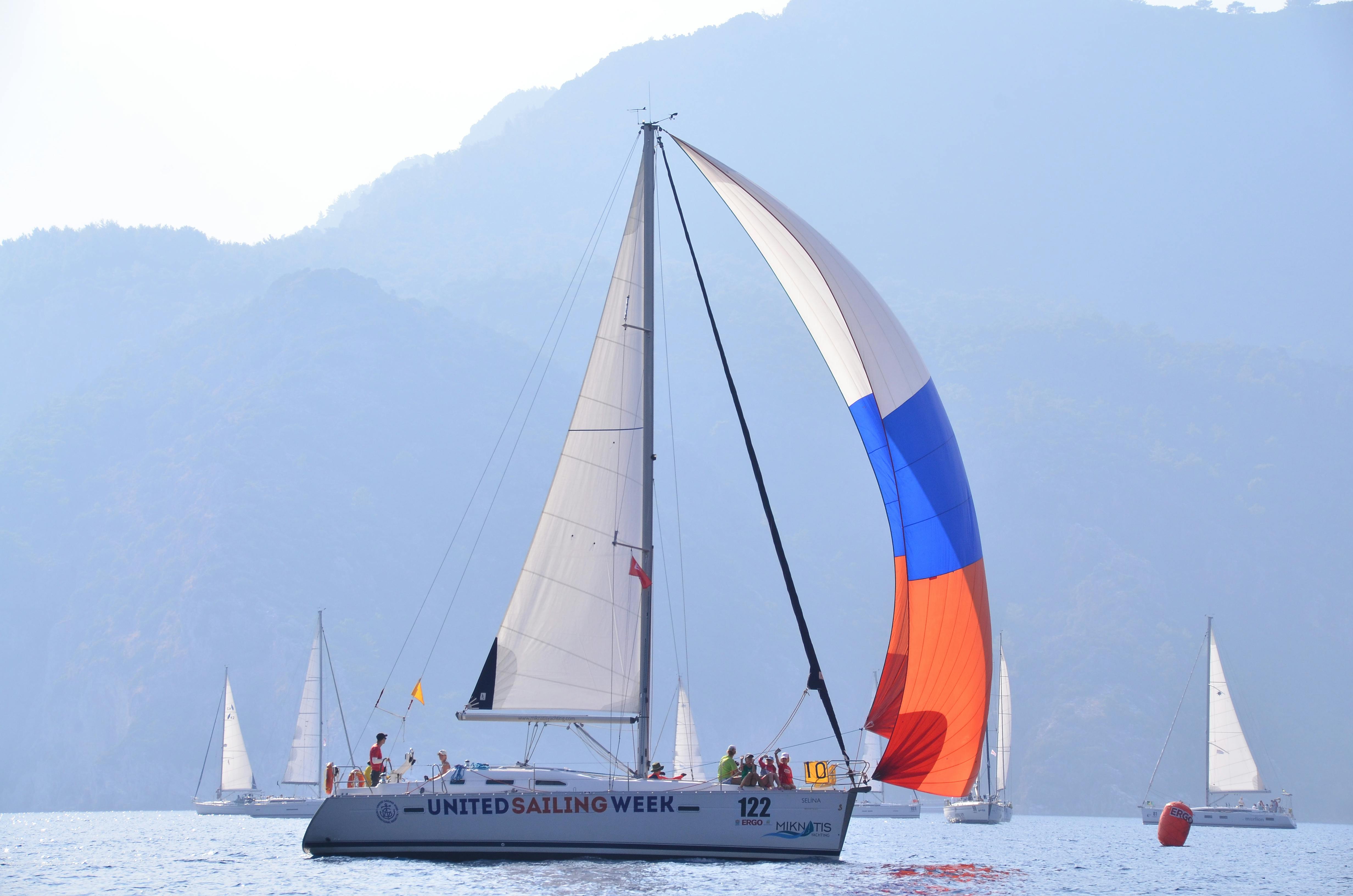 White and Blue Sailboat on Sea · Free Stock Photo