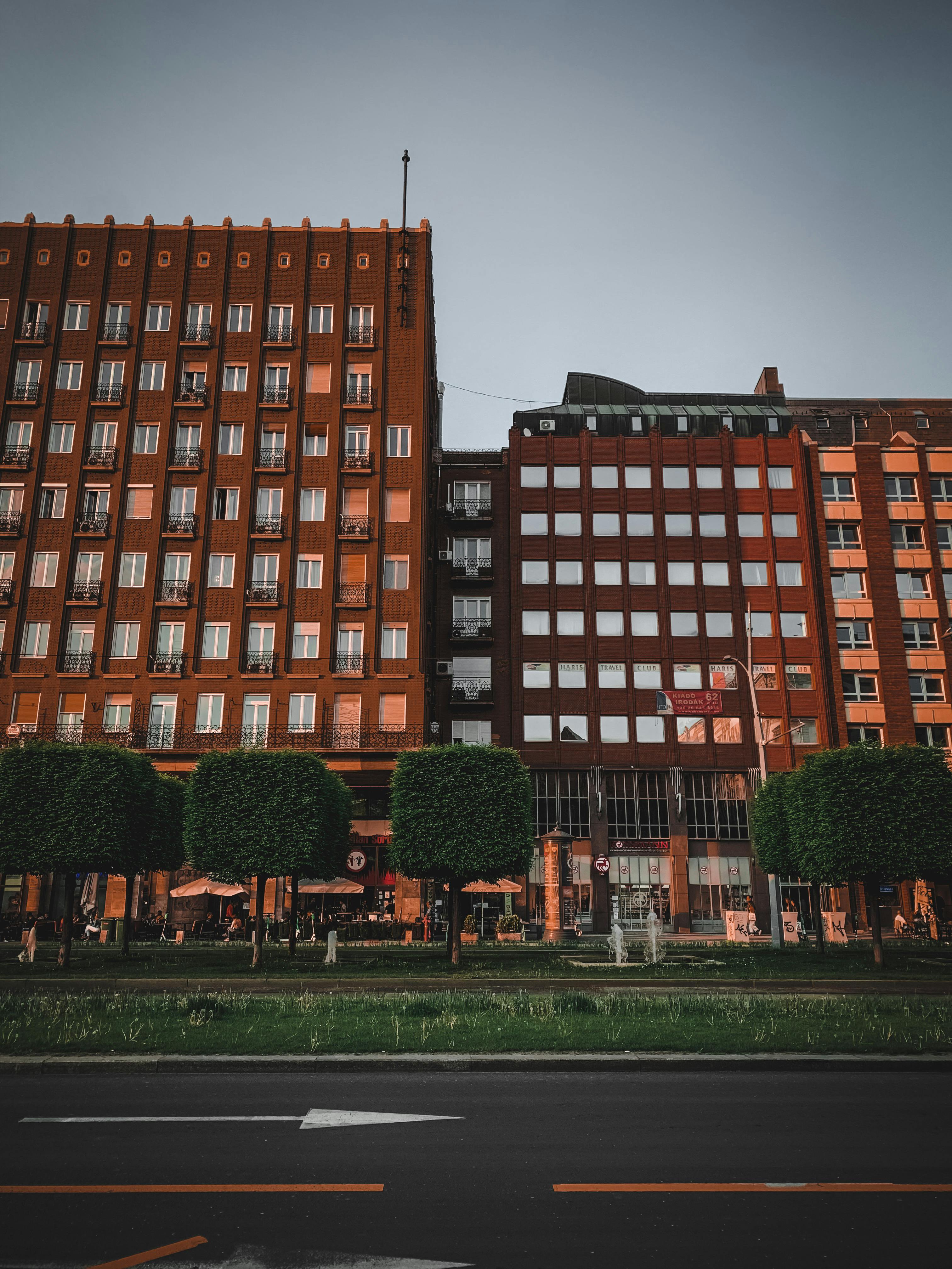 Brown Buildings by the Road · Free Stock Photo