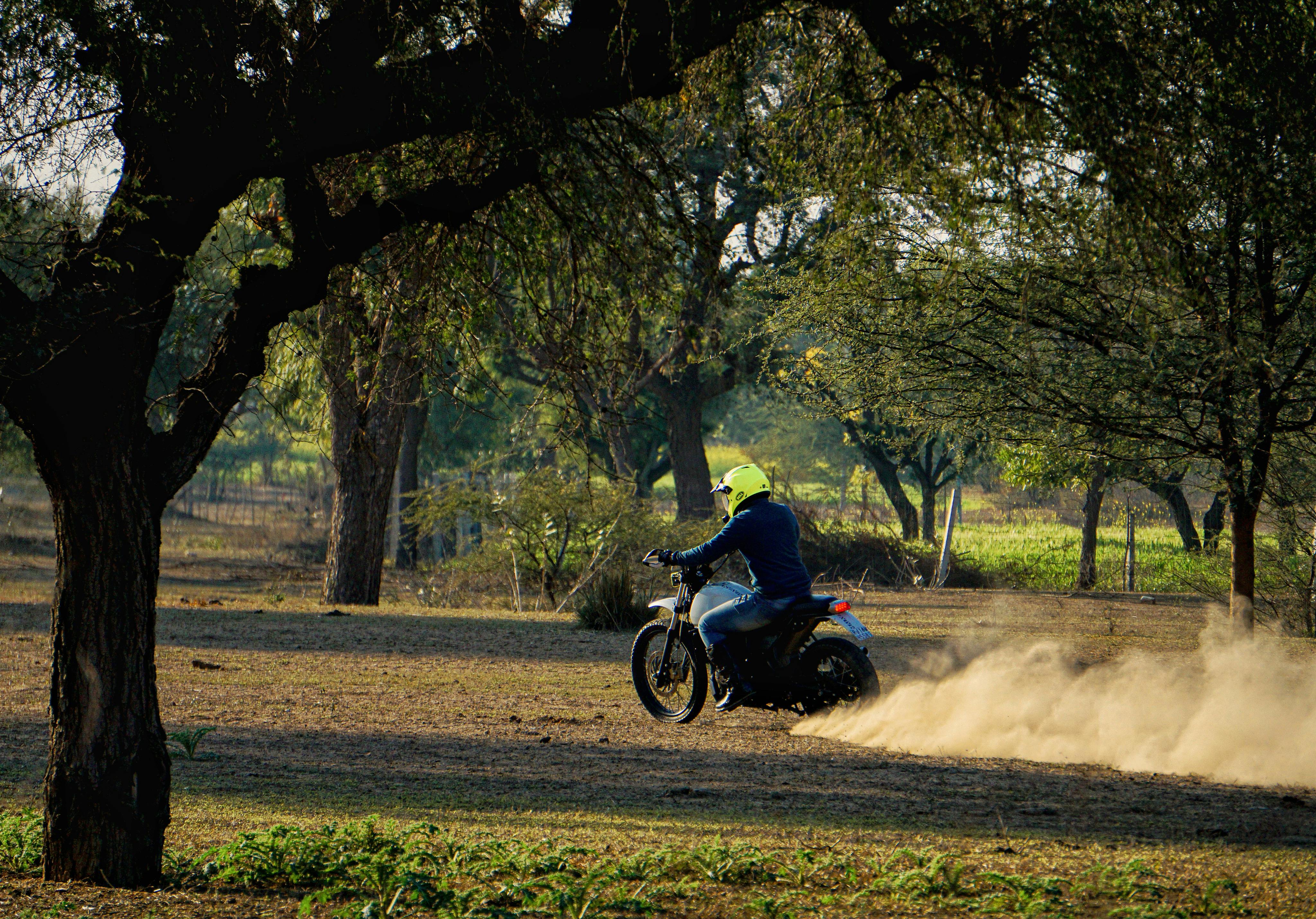 Man Riding Motorcycle on Grassland · Free Stock Photo