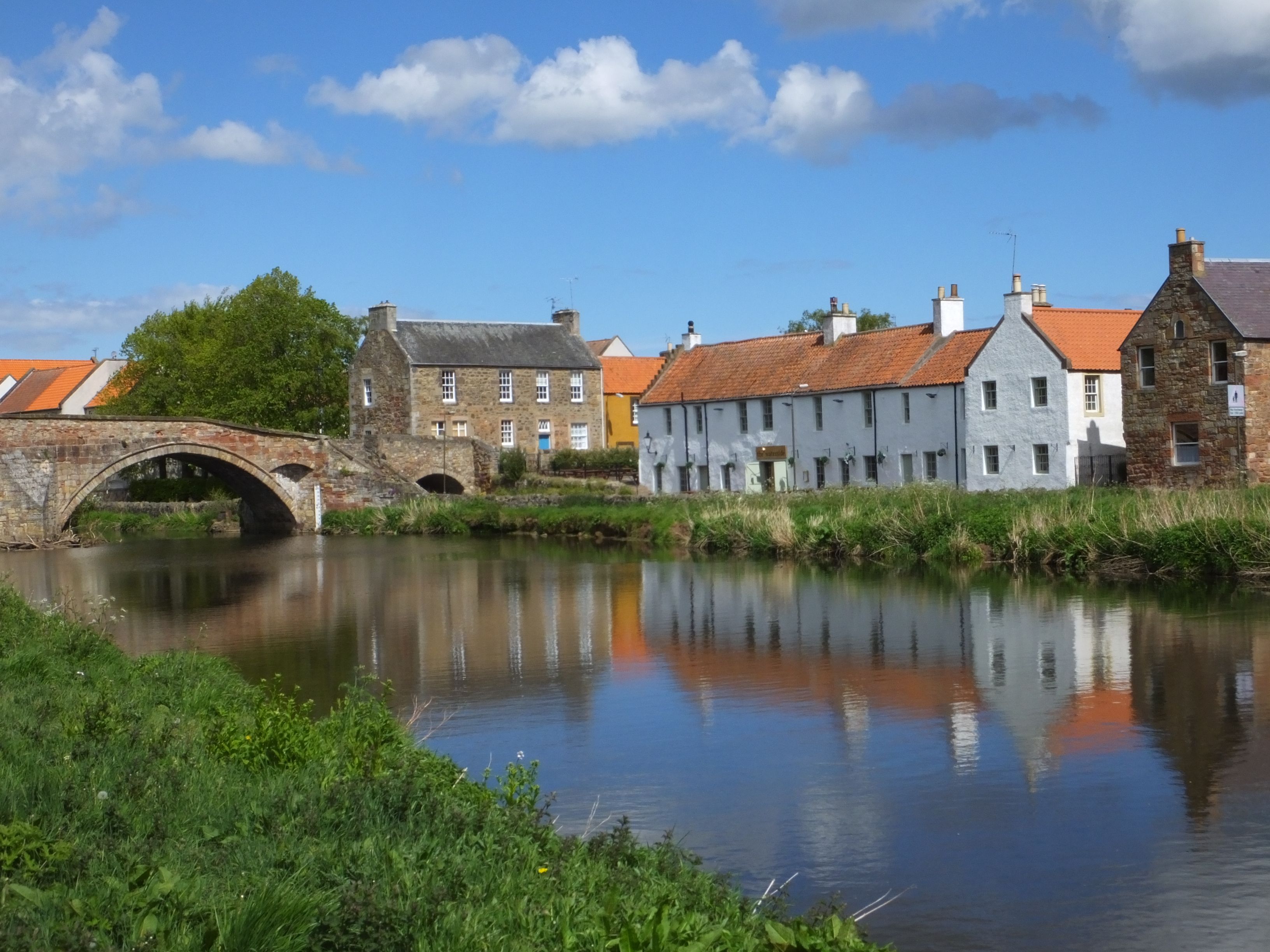 Castle on Hill over Village Near Body of Water · Free Stock Photo