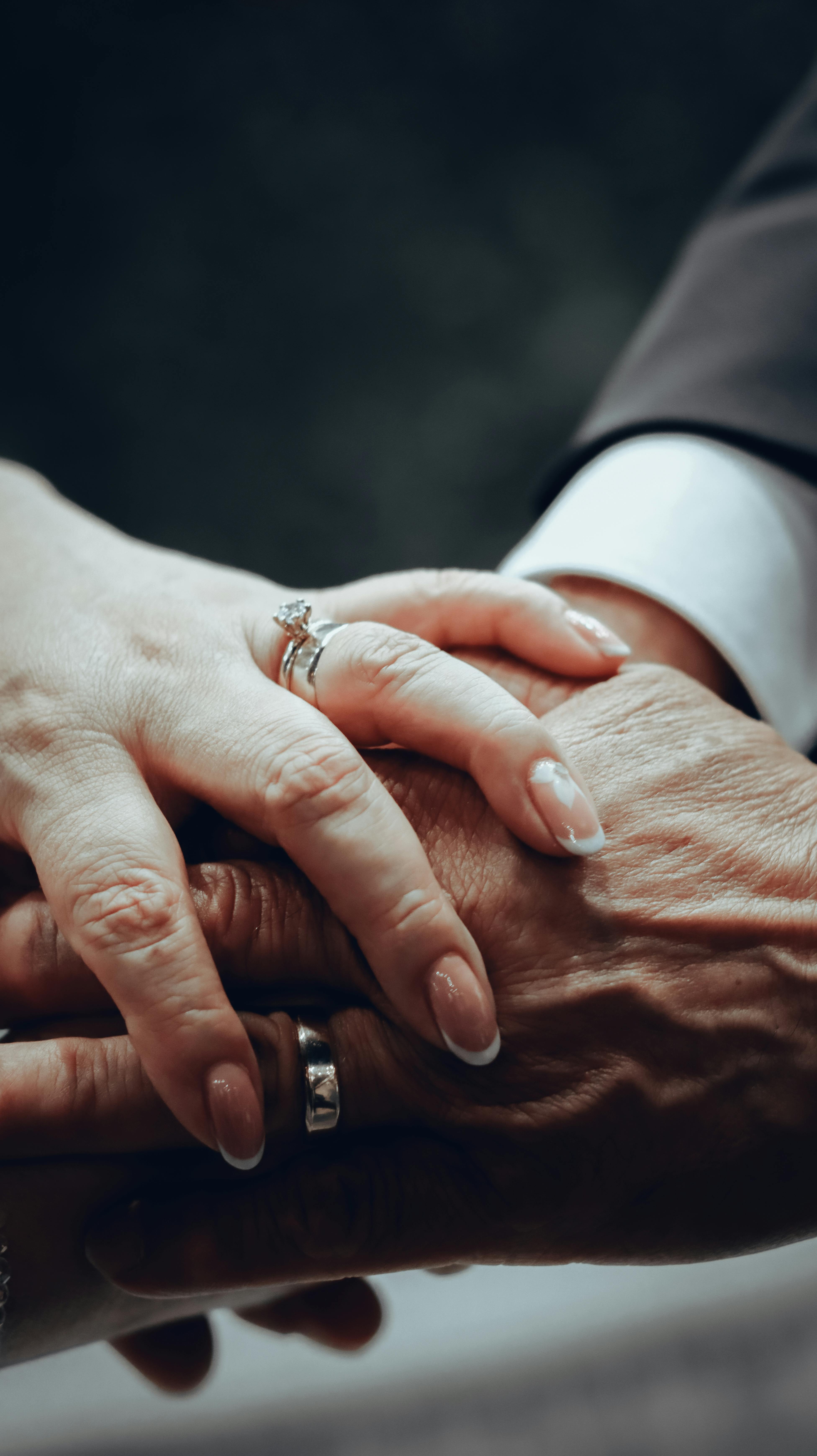A Couple Wearing their Wedding Rings · Free Stock Photo