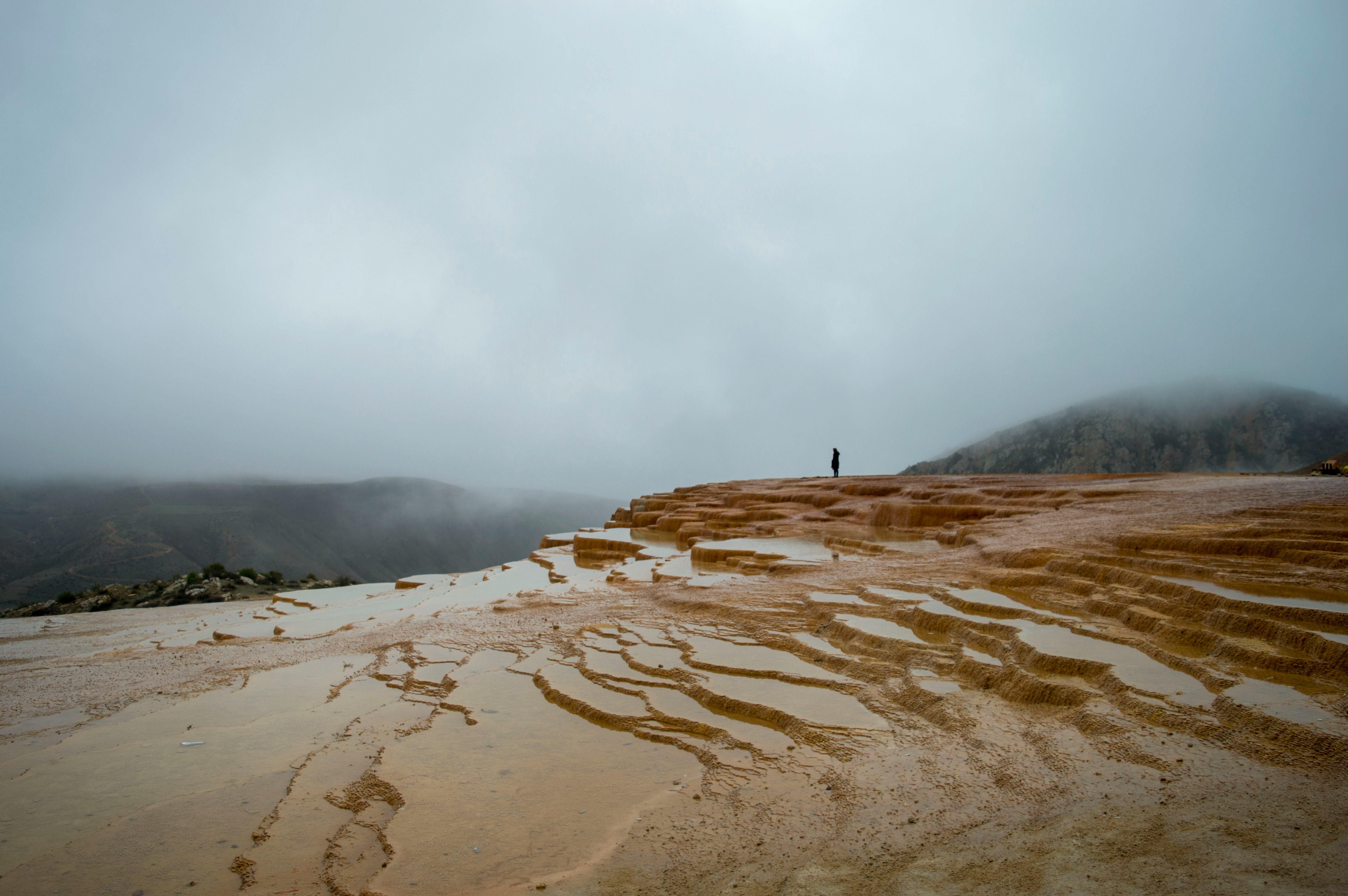 Foggy Landscape with a Person Standing on a Terraced Hill, Badab-e Surt ...