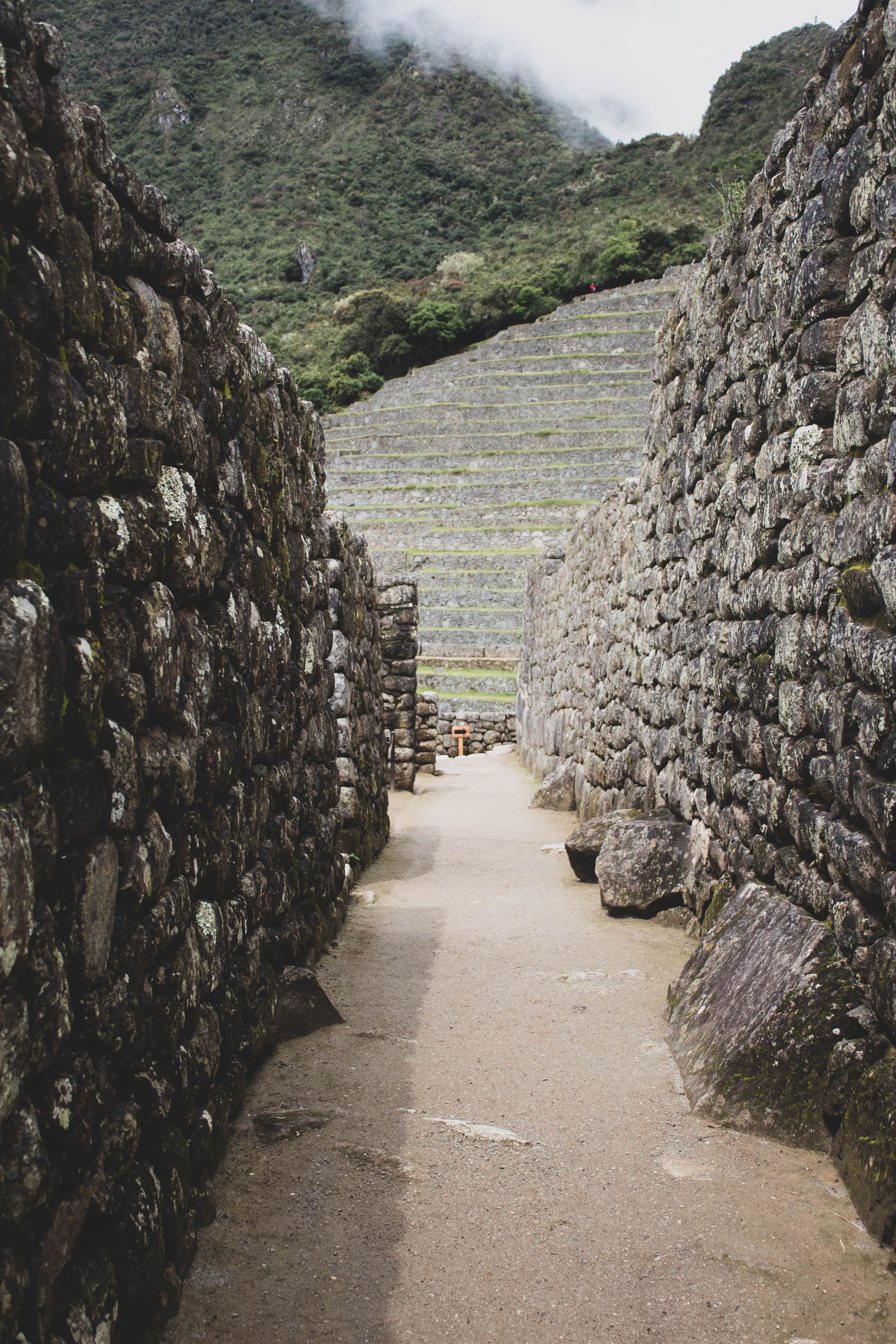 Walkway between Stone Walls · Free Stock Photo