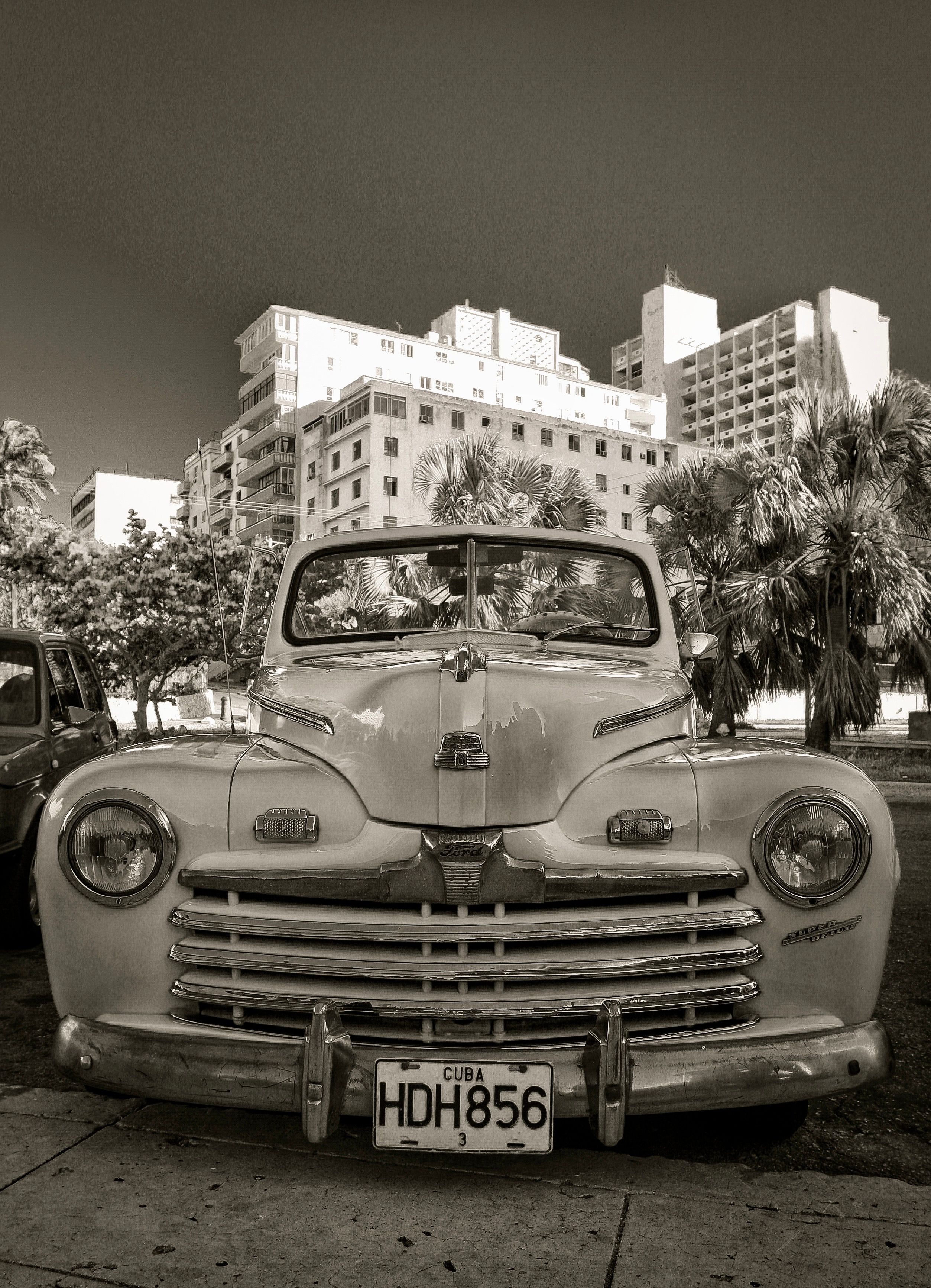 Grayscale Photo of a Vintage Car · Free Stock Photo