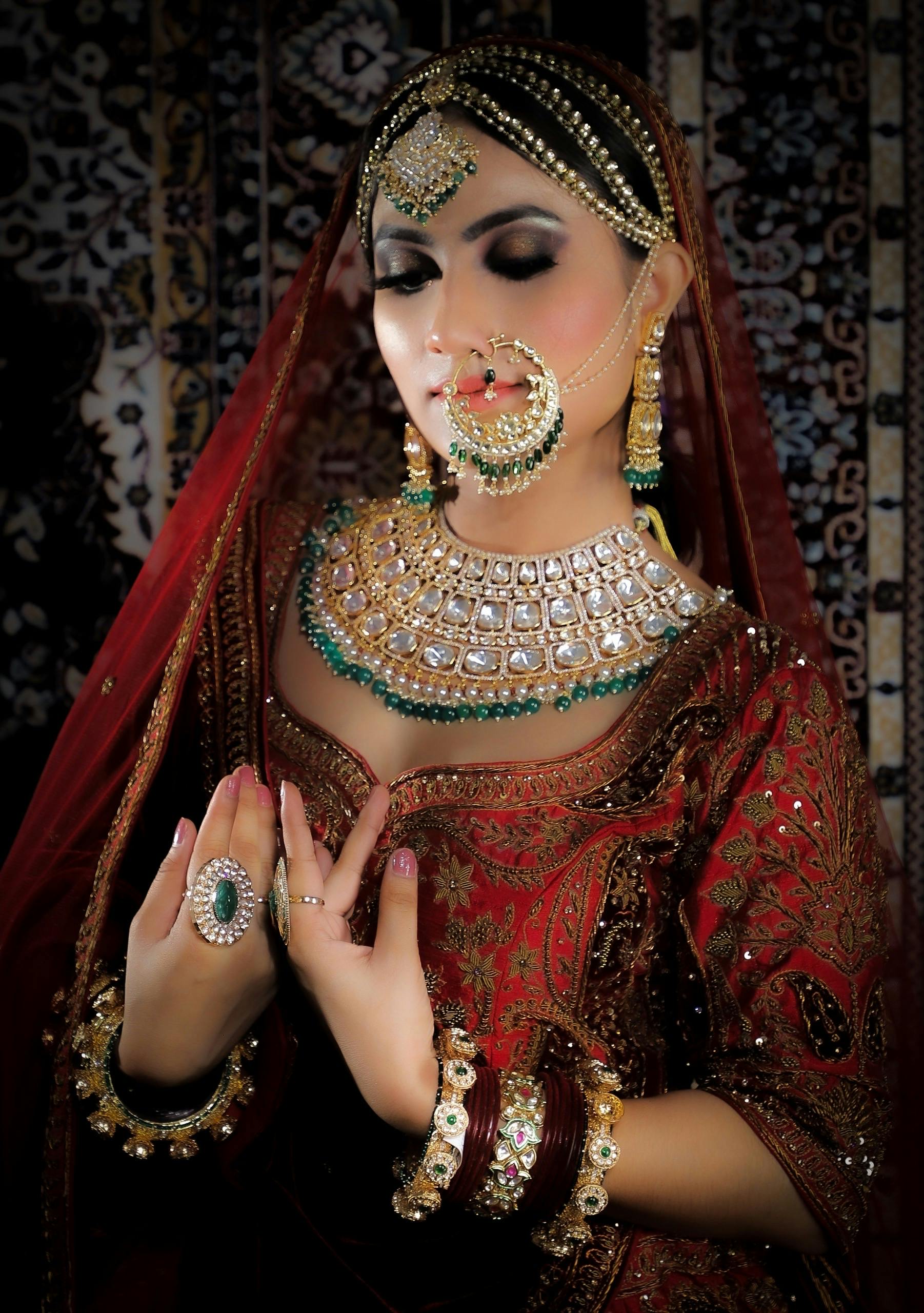 Woman in Red Traditional Clothing and Full of Jewelries · Free Stock Photo