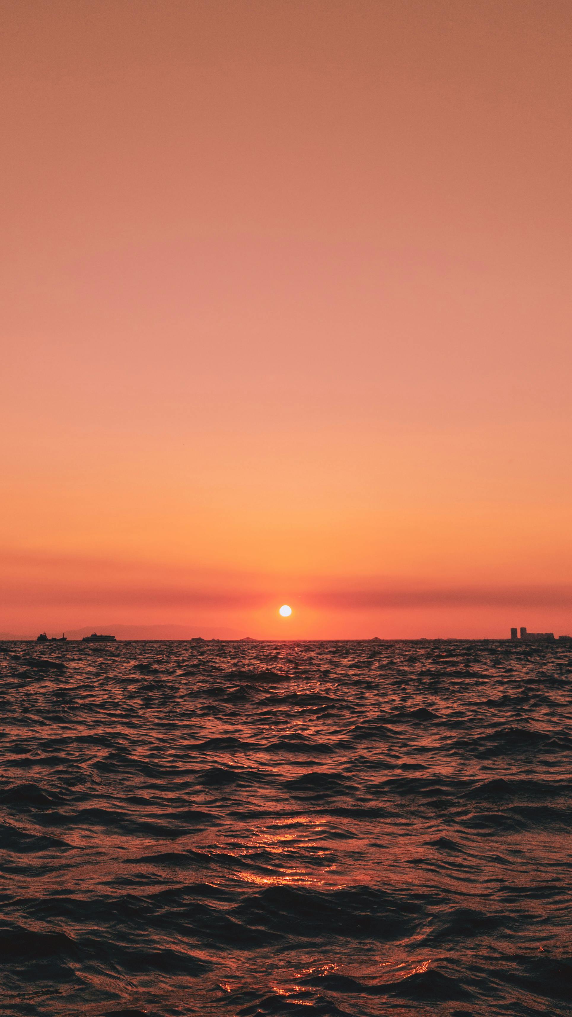 Photo of The Ocean Waves During Sunset · Free Stock Photo