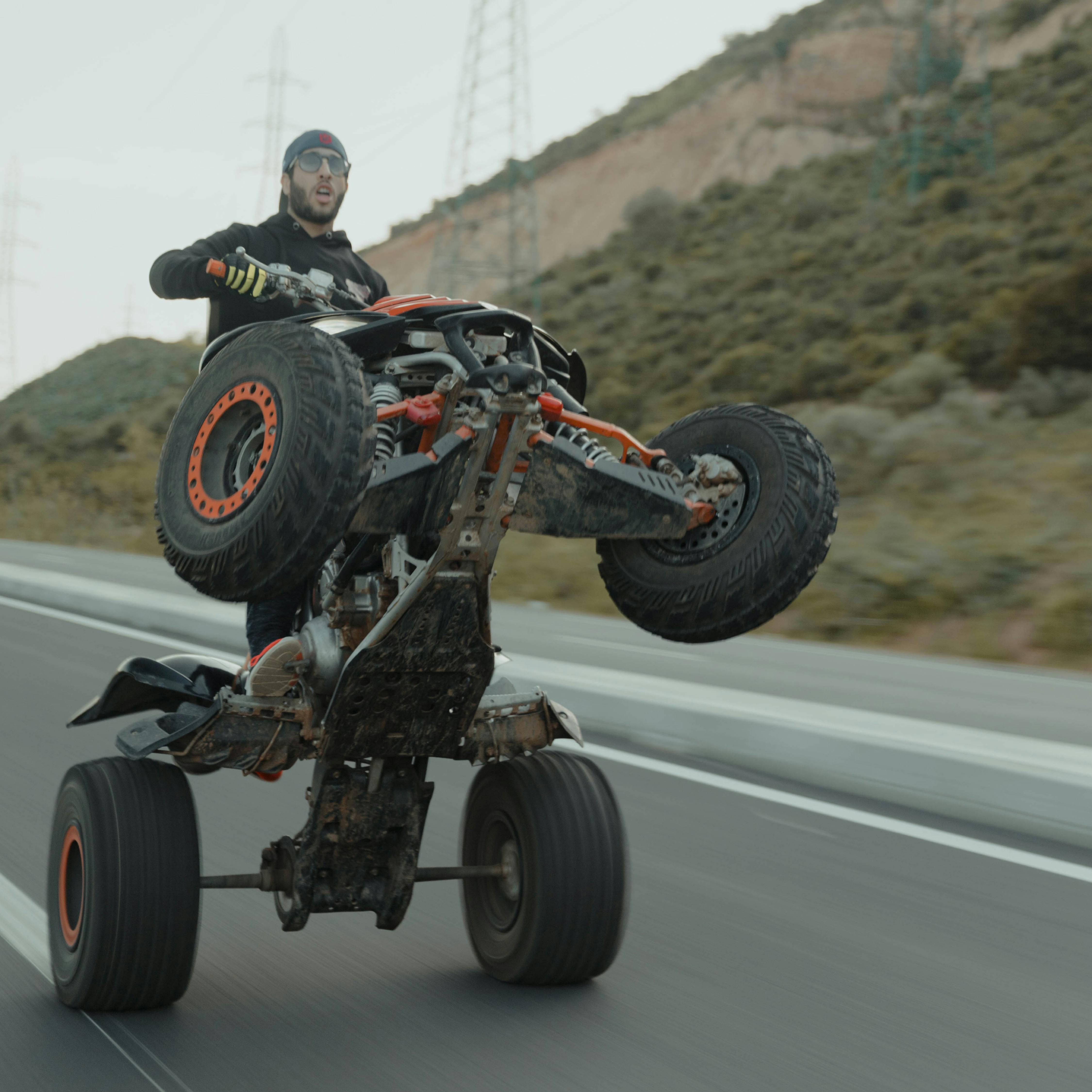 Man Doing a Trick on an ATV · Free Stock Photo