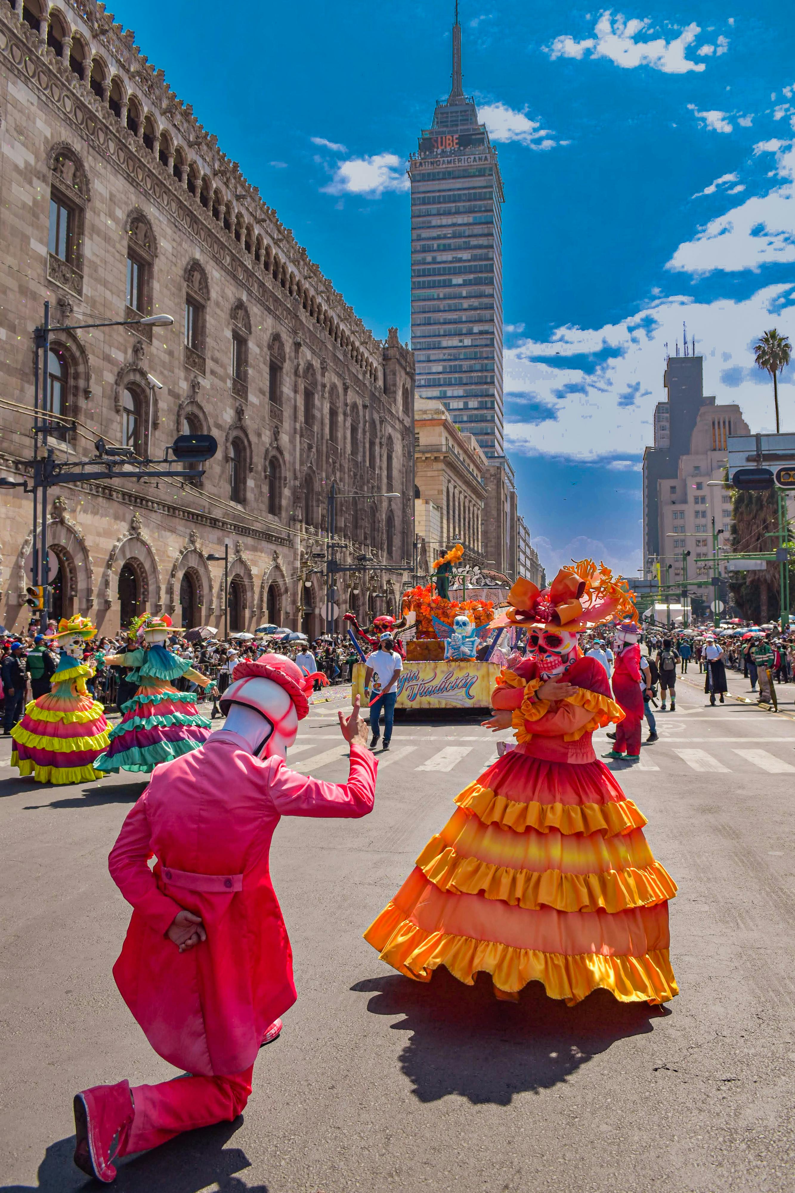 Catrin in a Pink Frock Coat kneeling in front of Catrina in an Orange ...