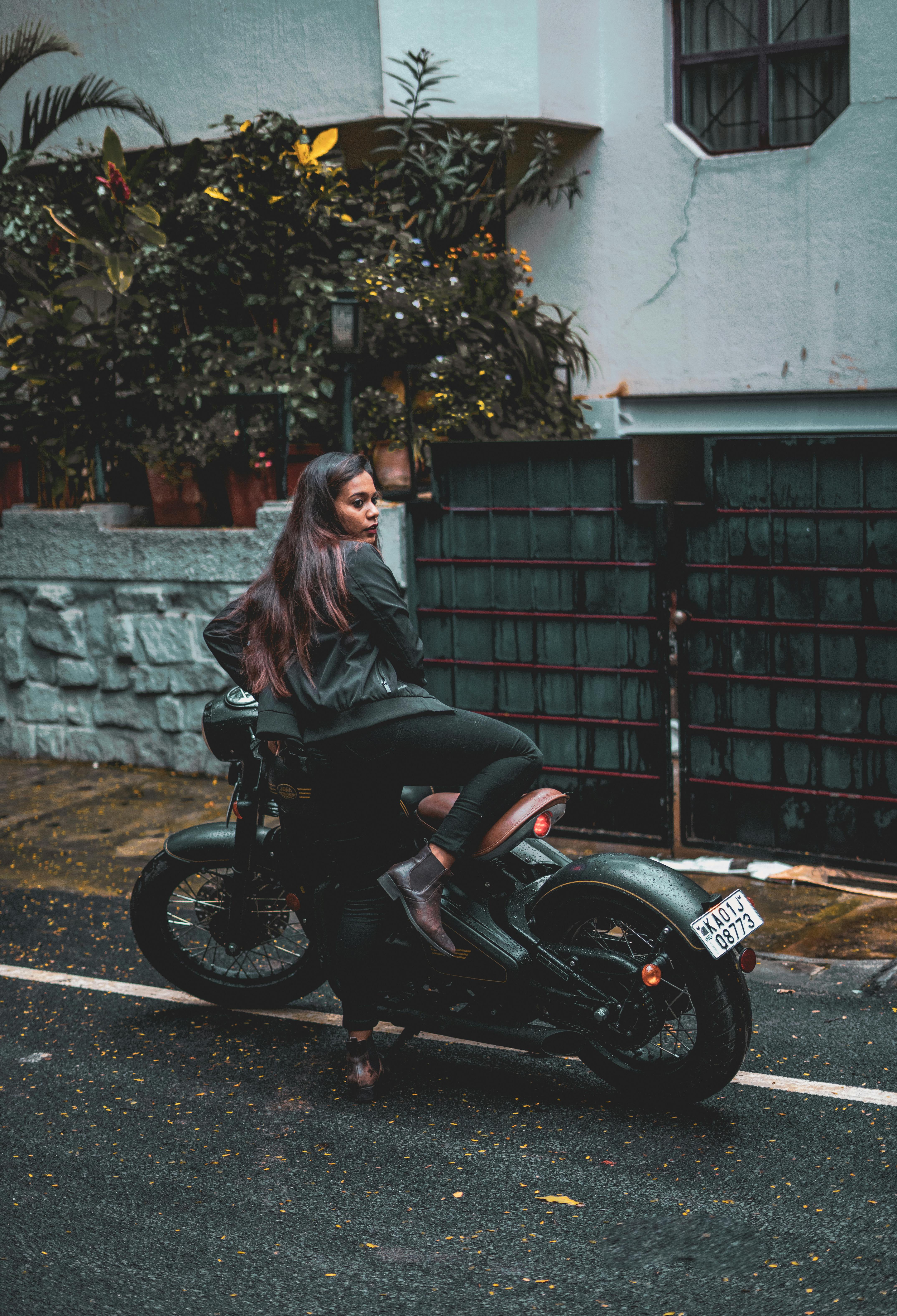 A Woman Riding a Motorcycle · Free Stock Photo