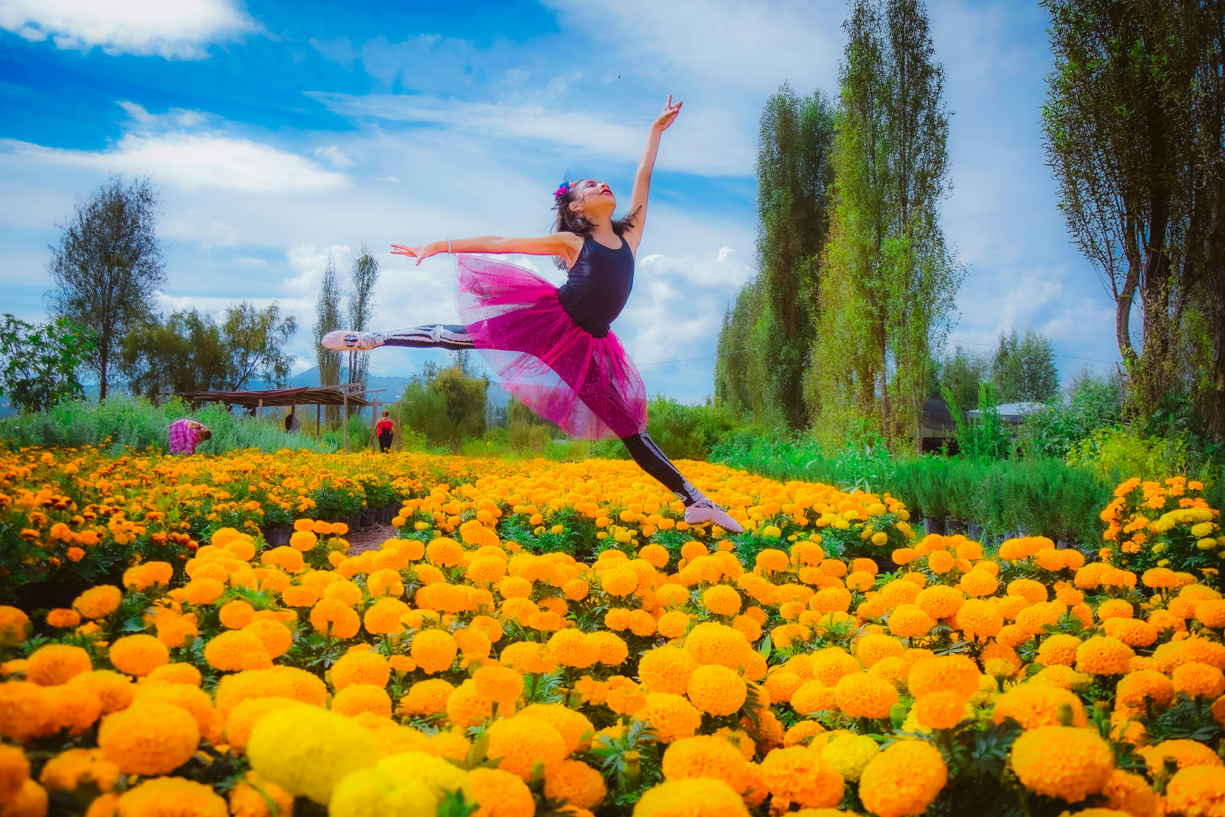Photo of a Girl Midair Wearing a Pink Tutu · Free Stock Photo