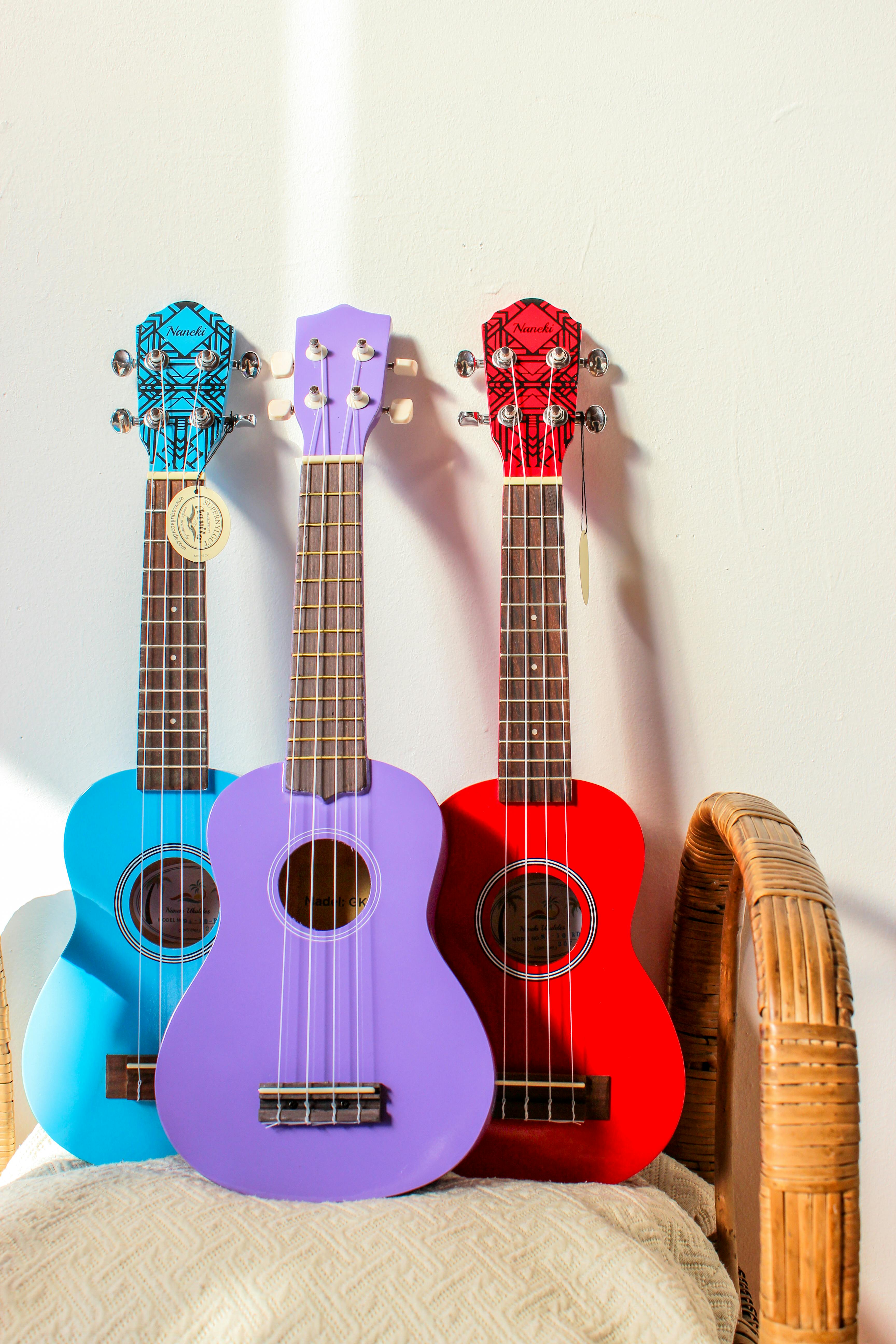 A Colorful Ukuleles Near the Wall · Free Stock Photo