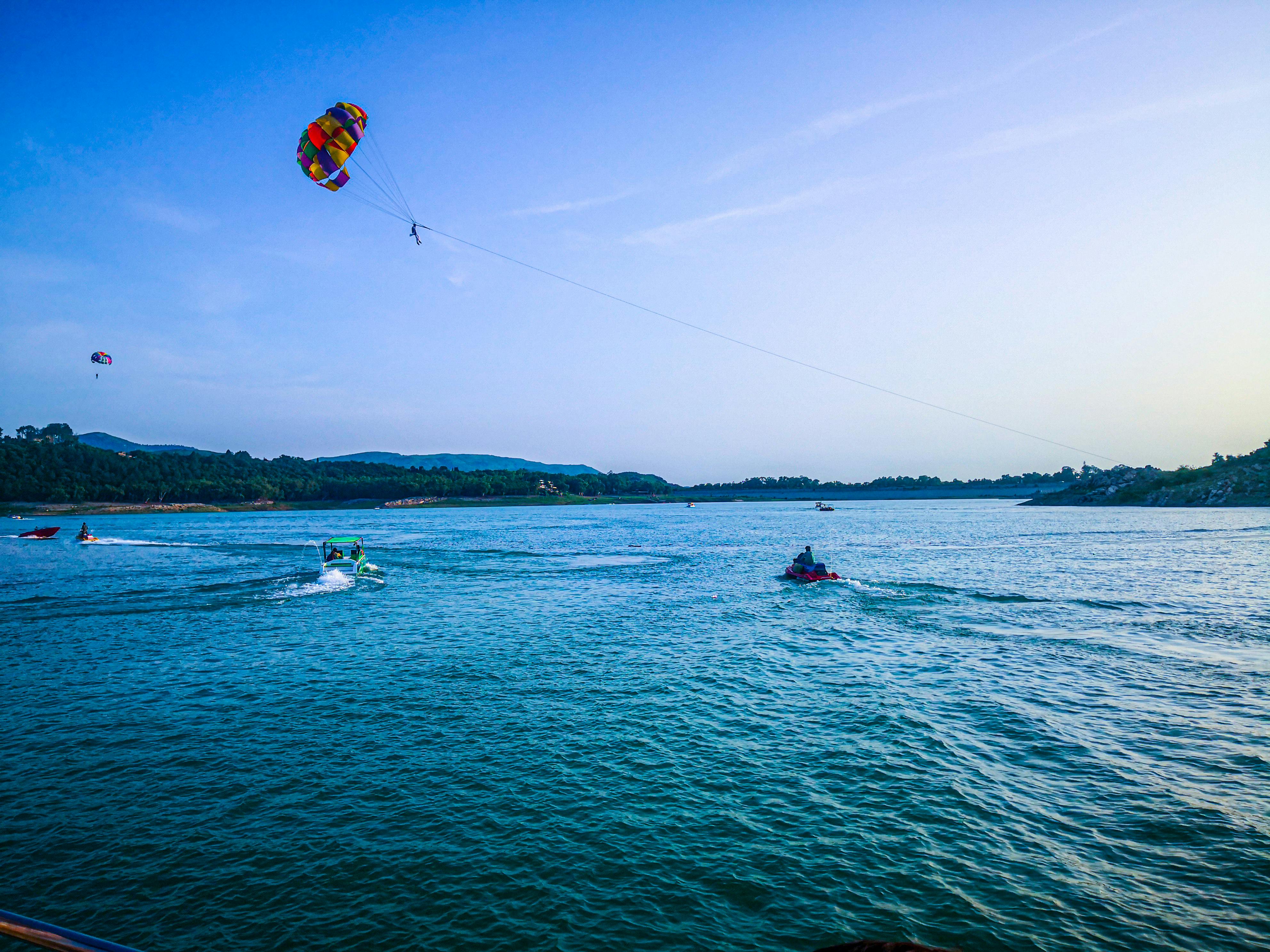 People Riding on White and Blue Boat on Sea · Free Stock Photo