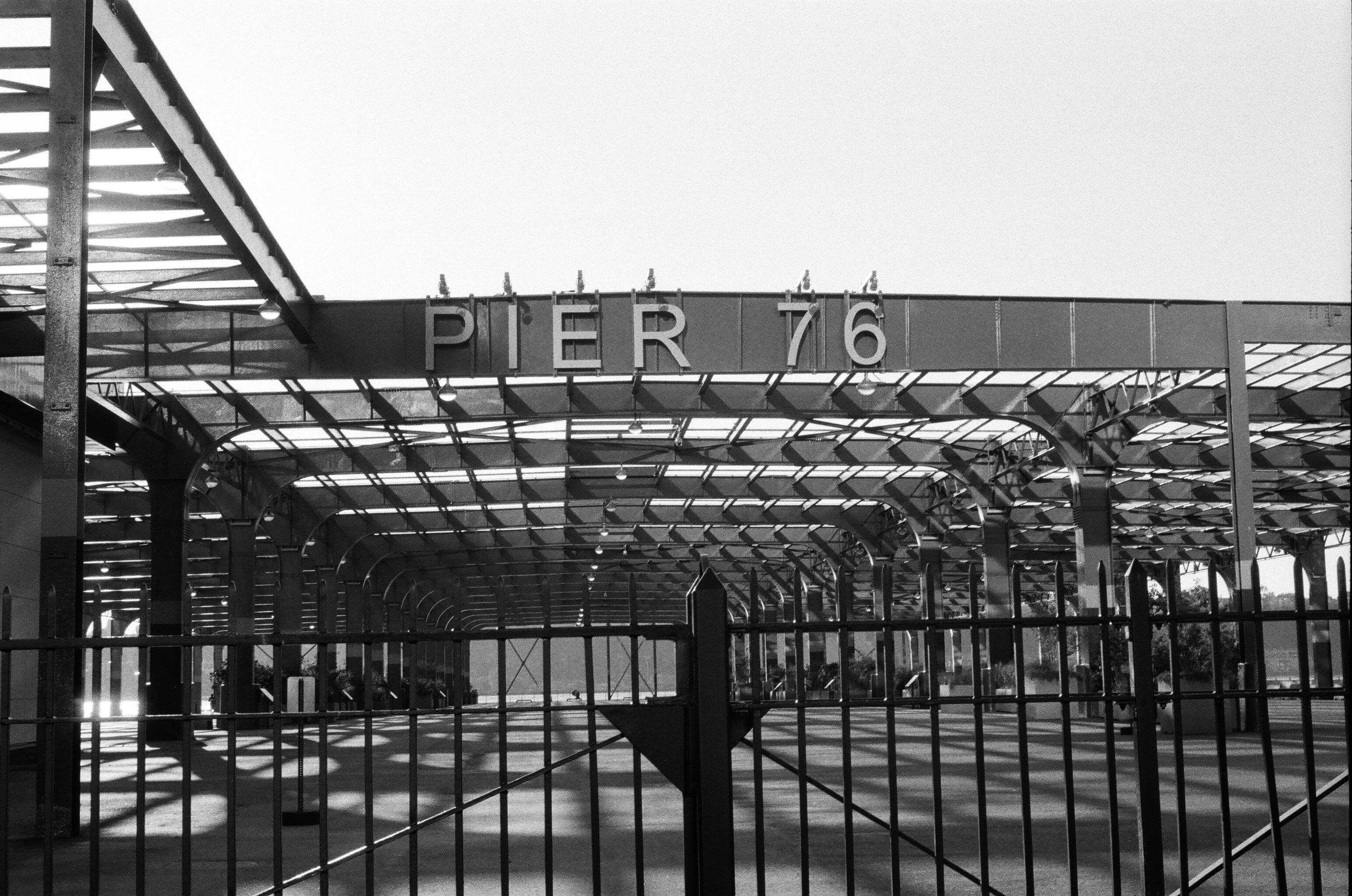 Grayscale Photo of the Signage of Pier 76 · Free Stock Photo