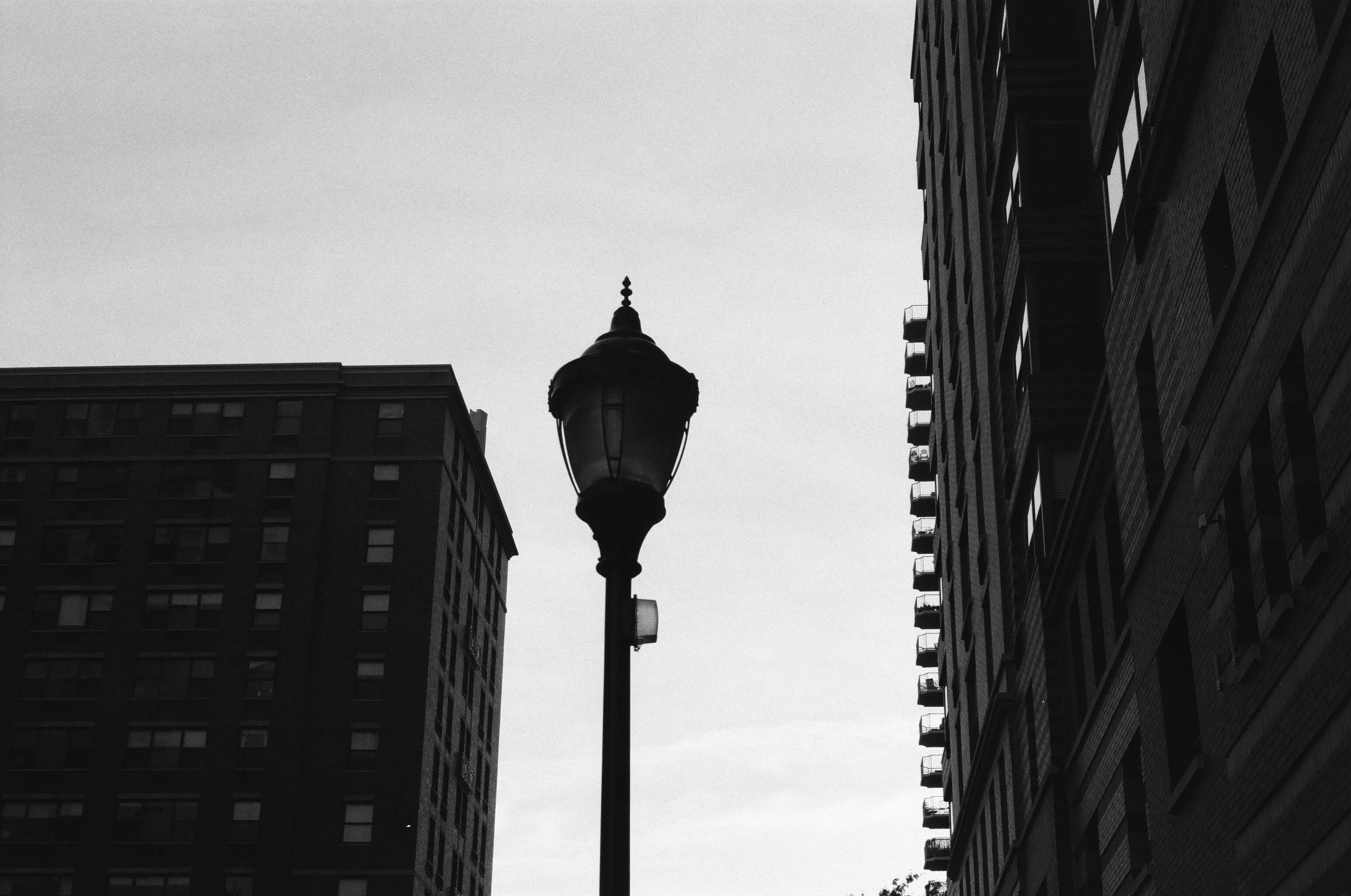 Grayscale Photo of a High Rise Building · Free Stock Photo