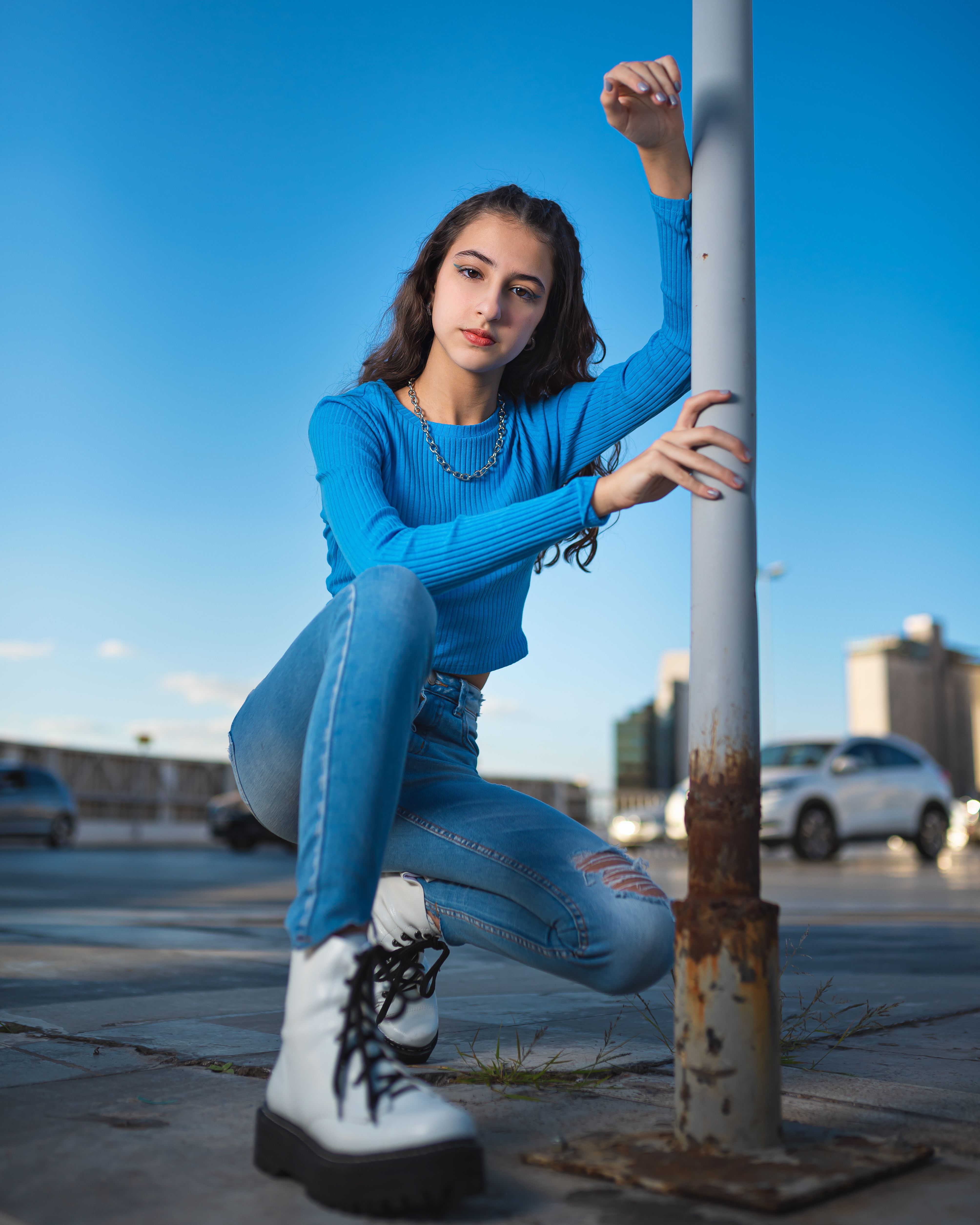 Photo of a Crouching Teenage Girl · Free Stock Photo