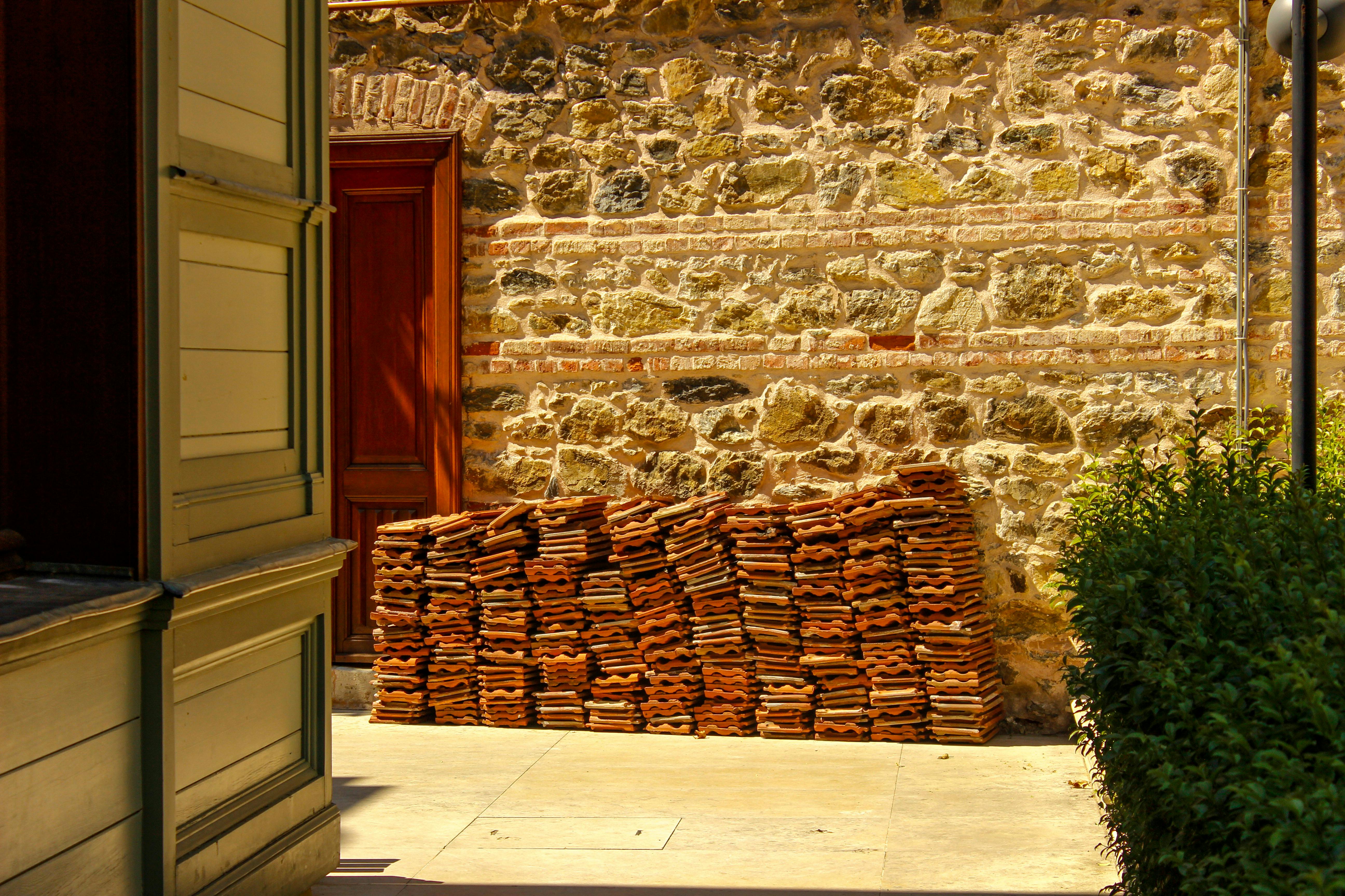 Sunlit Stone Wall · Free Stock Photo