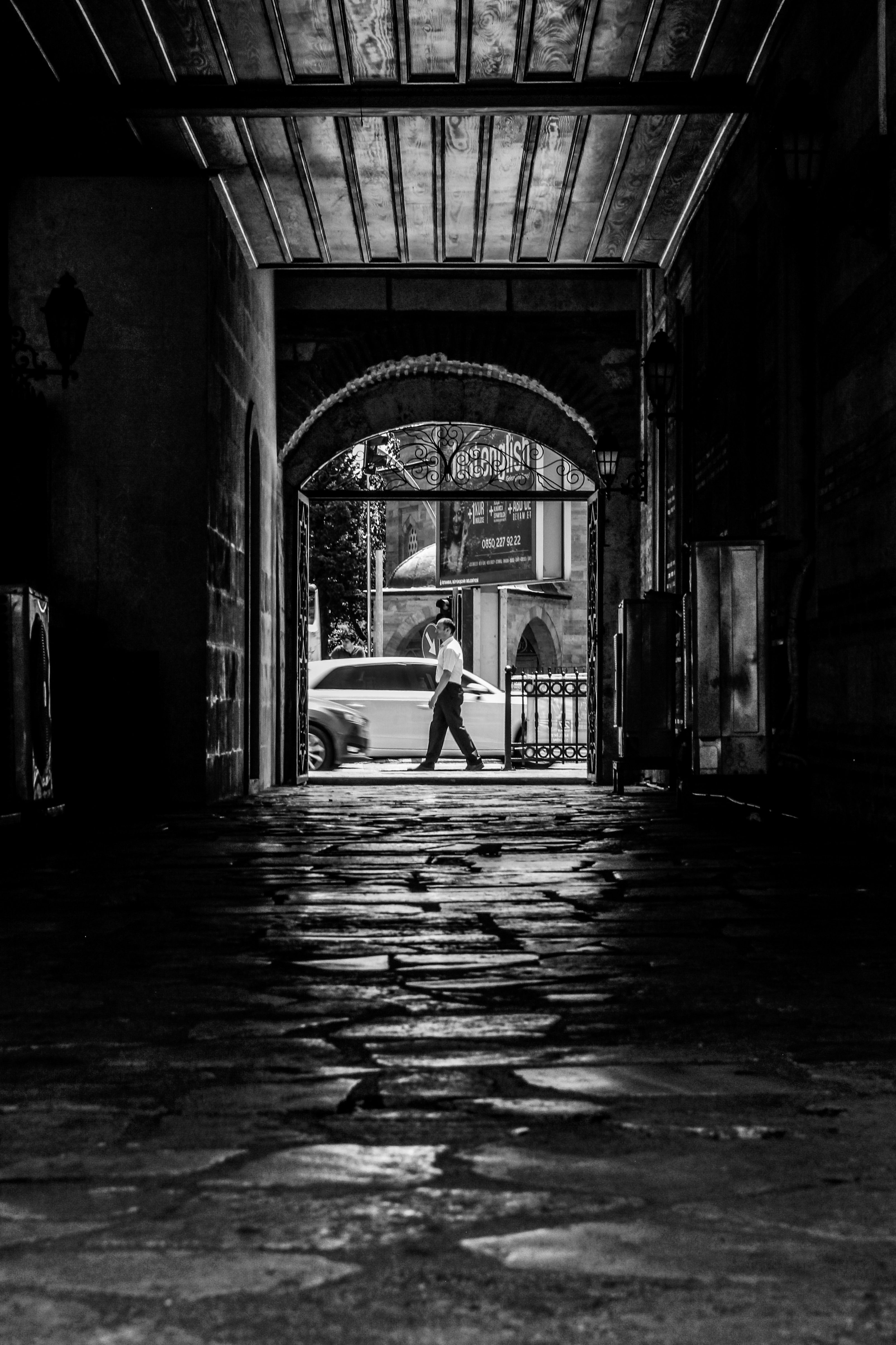 Monochrome Photo of Arch Pathway · Free Stock Photo