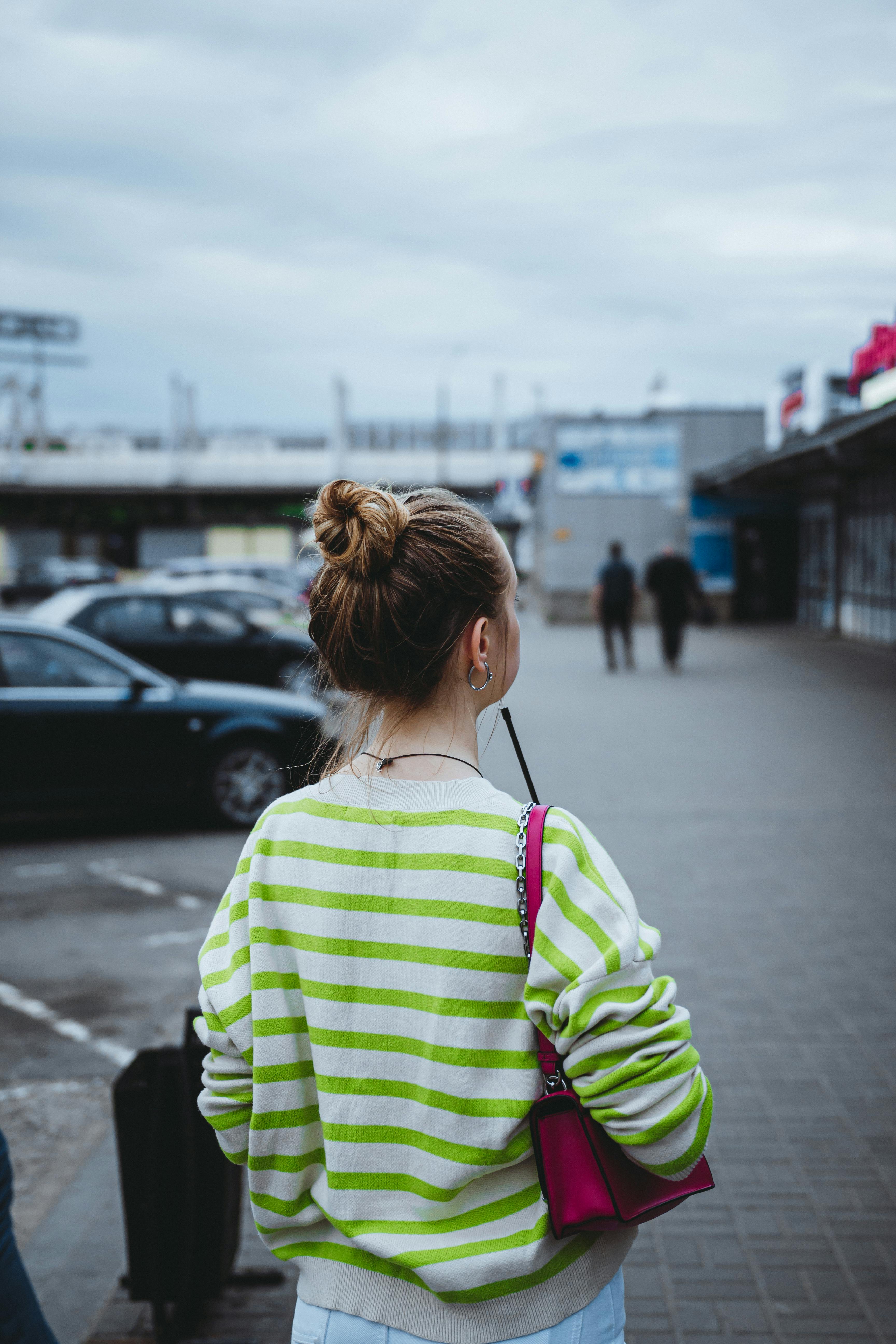 Back View of a Woman in a Striped Shirt · Free Stock Photo