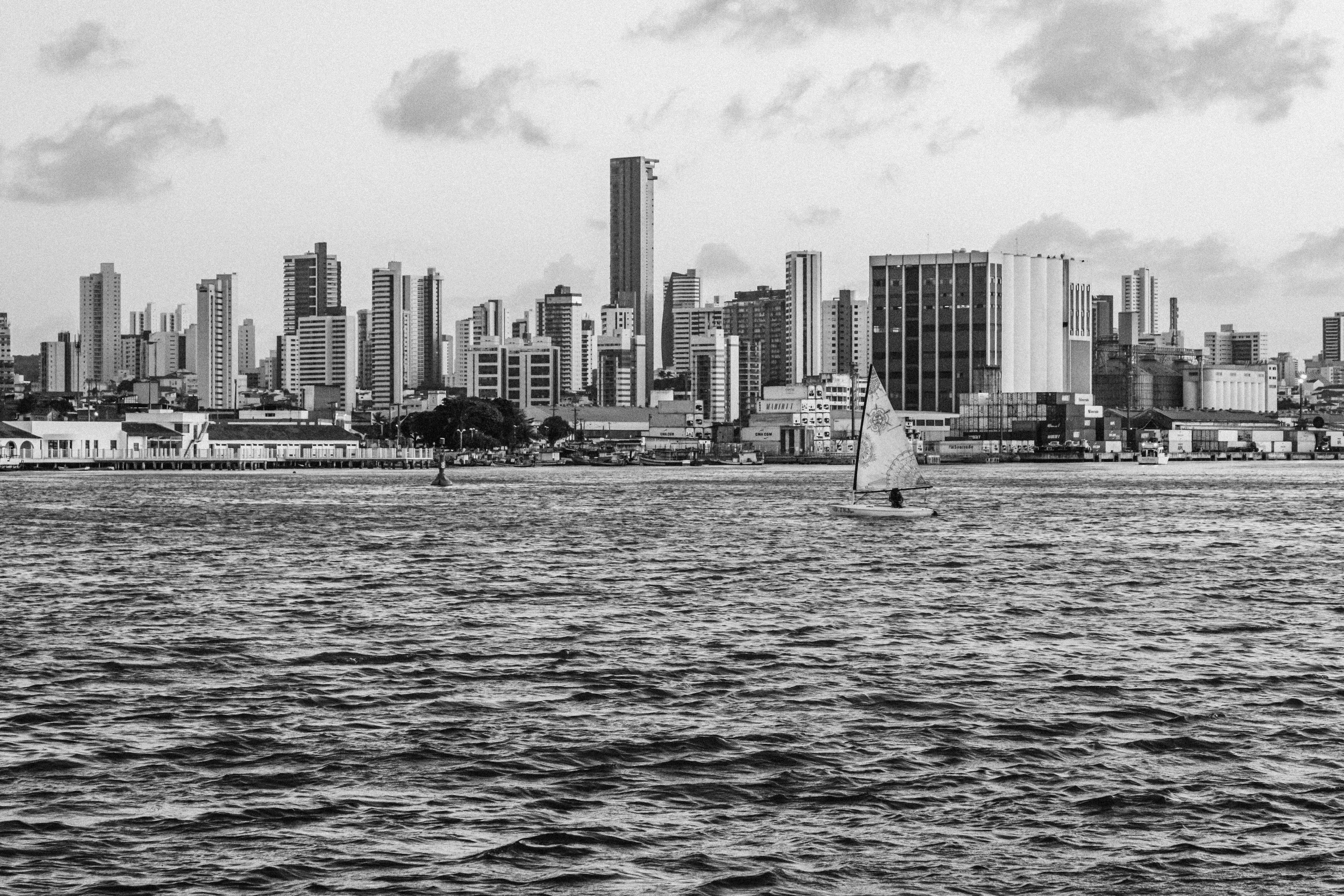 Grayscale Photo of High Rise Buildings in the City near Ocean · Free ...