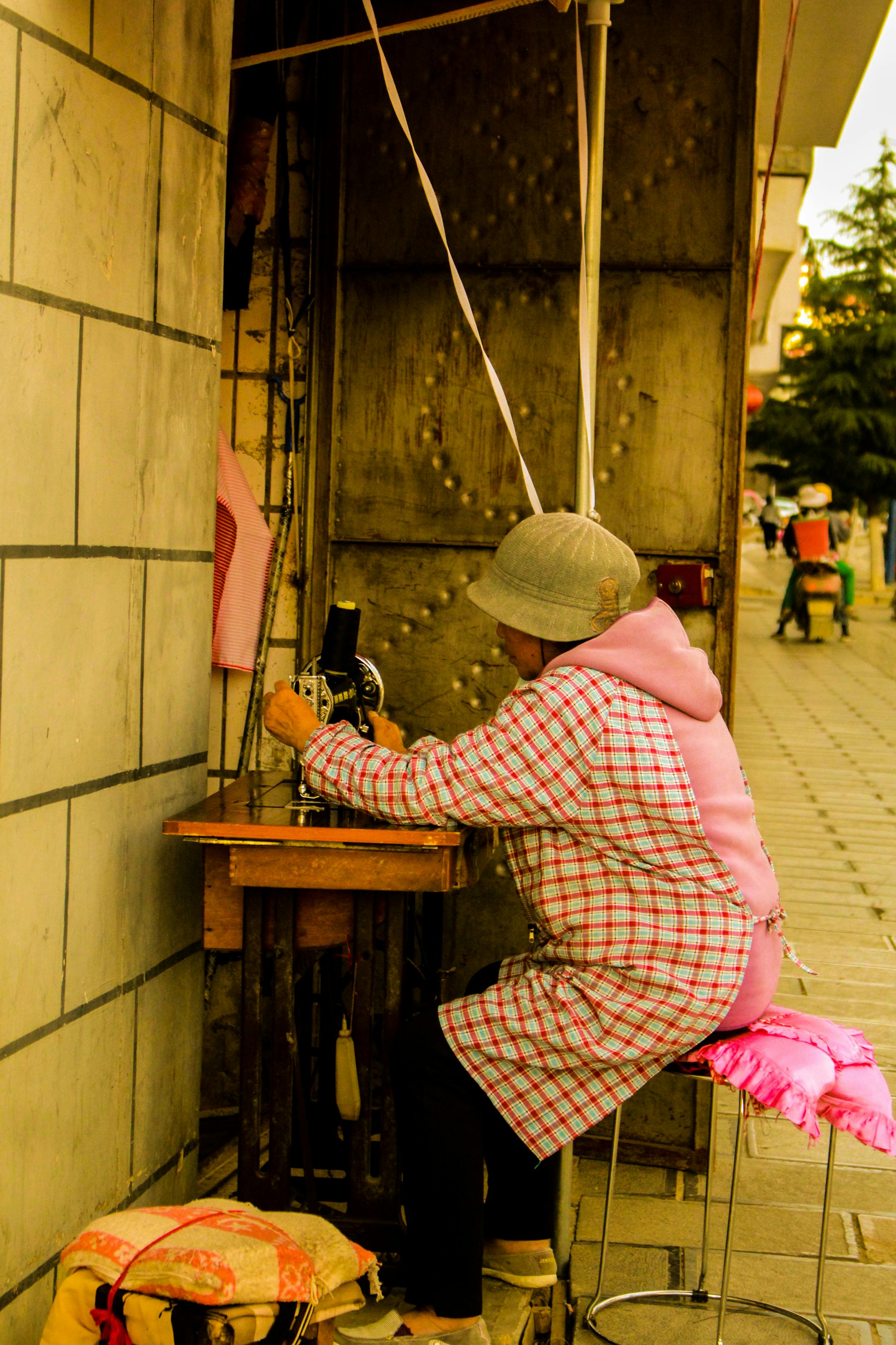 Person Using a Sewing Machine · Free Stock Photo