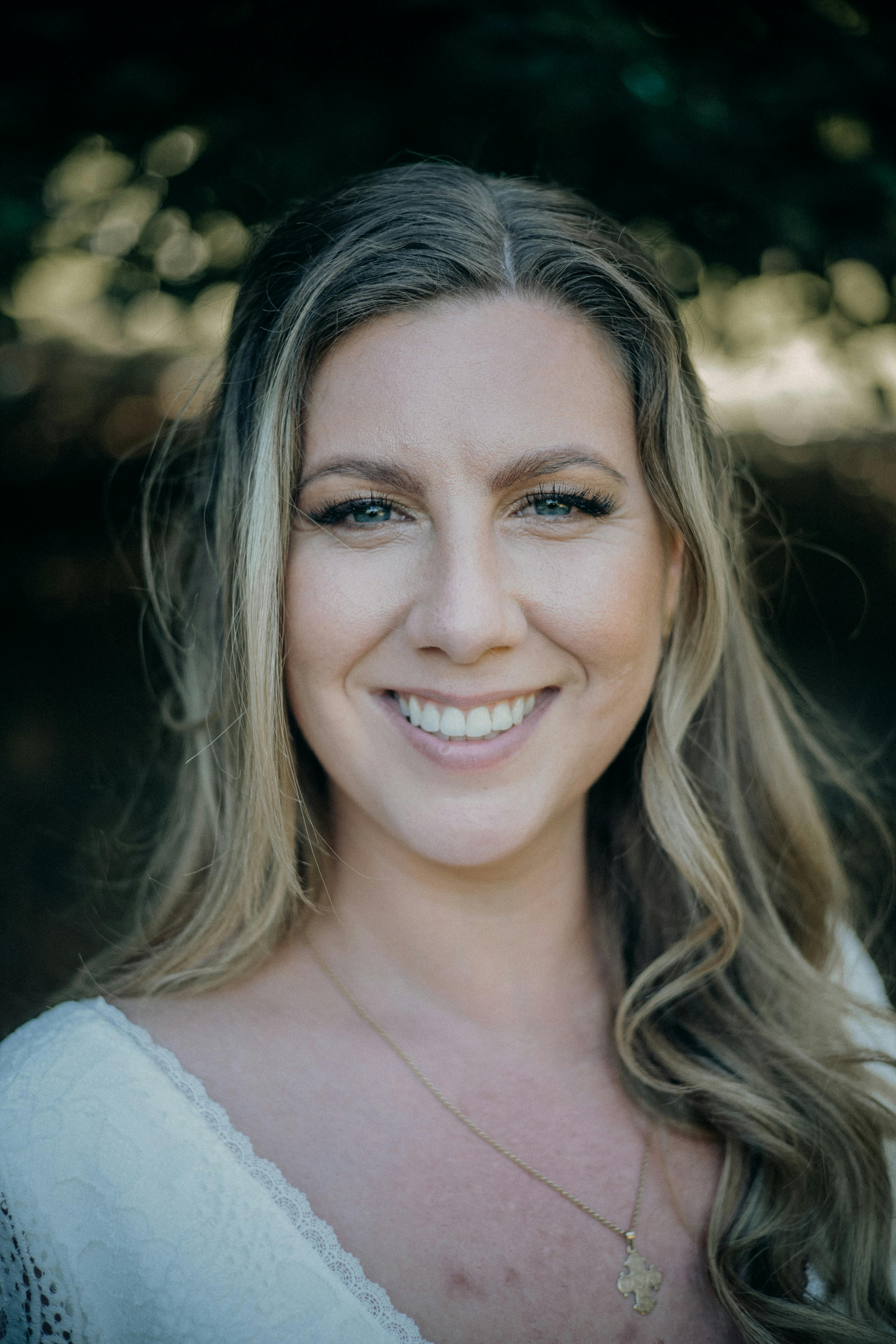 Close-Up Shot of a Woman Smiling · Free Stock Photo