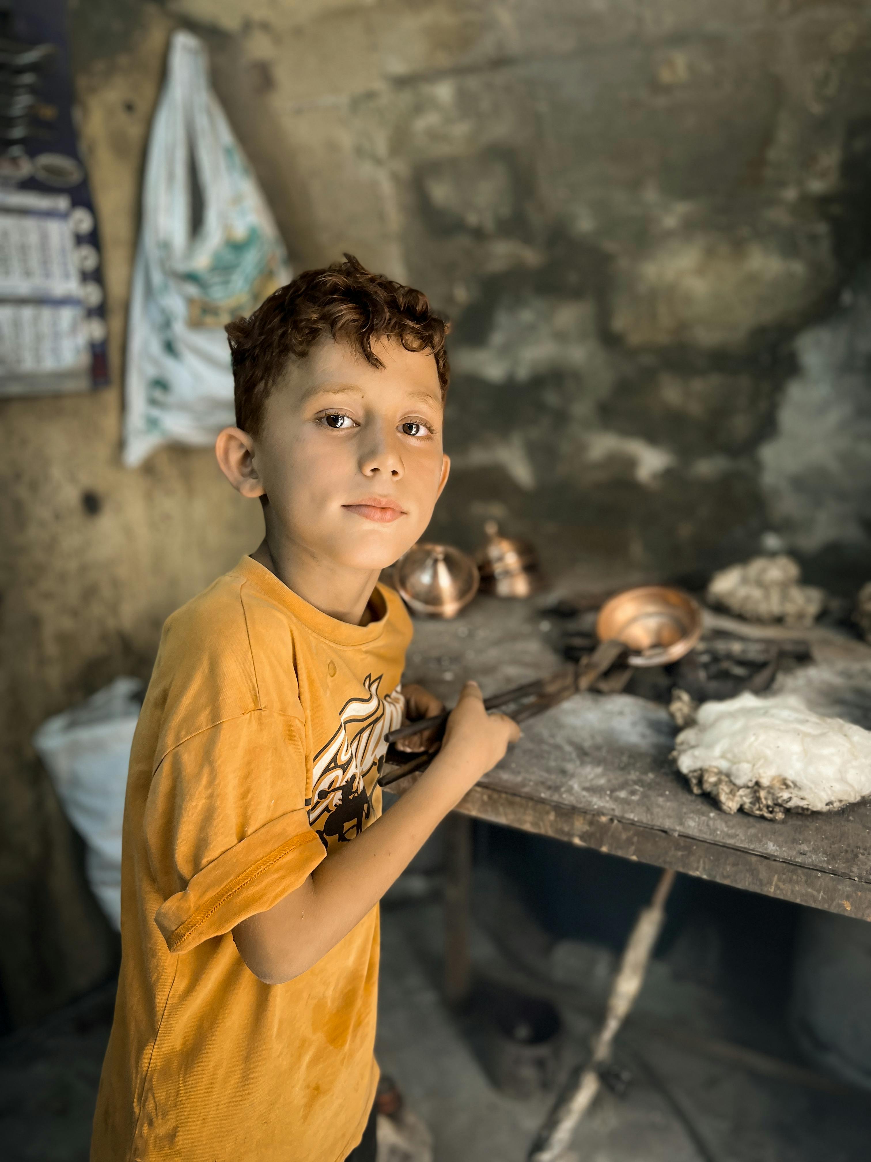 Young Boy in a Traditional Workshop · Free Stock Photo