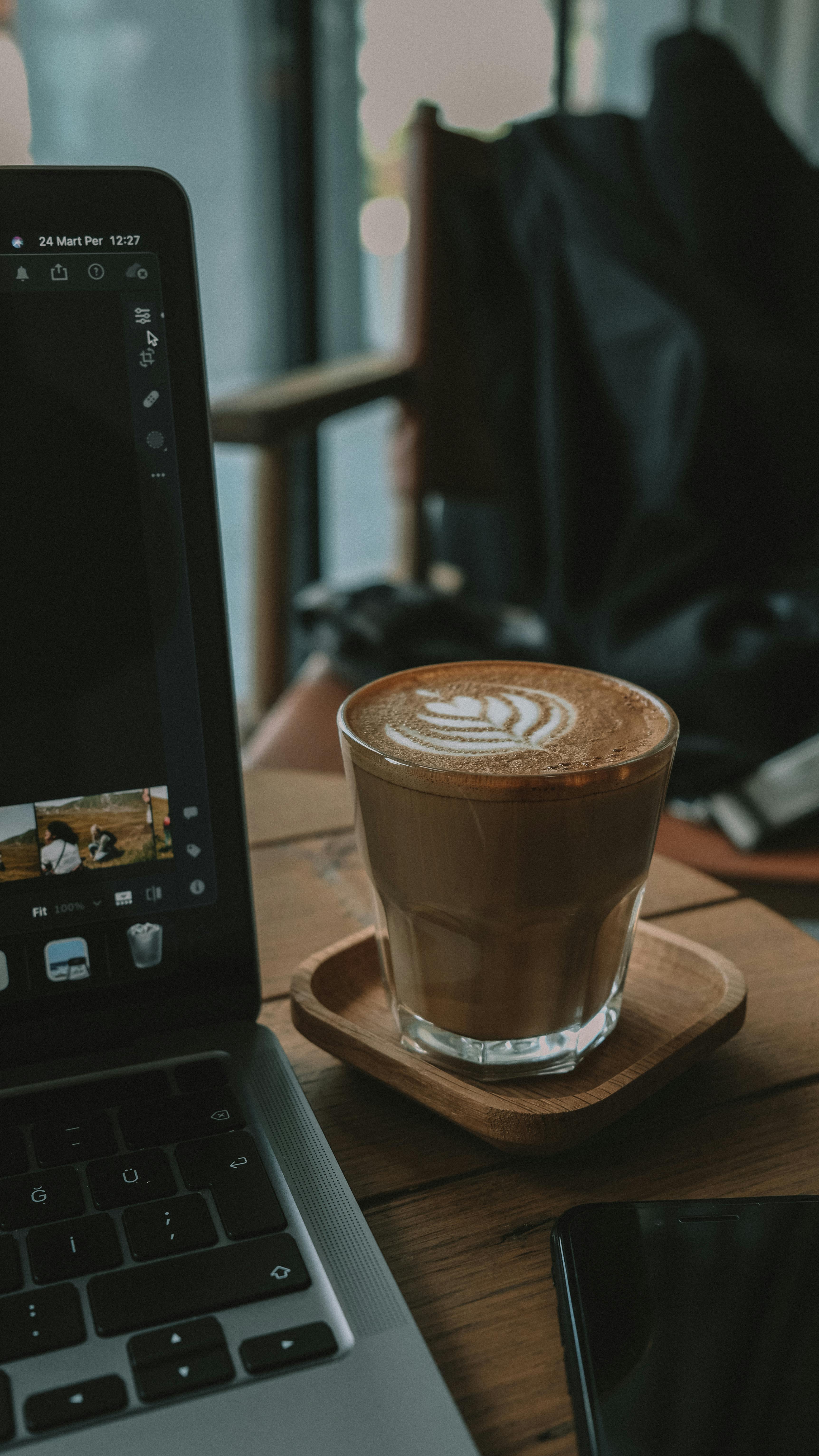 Photo of a Glass with Coffee Near a Laptop · Free Stock Photo