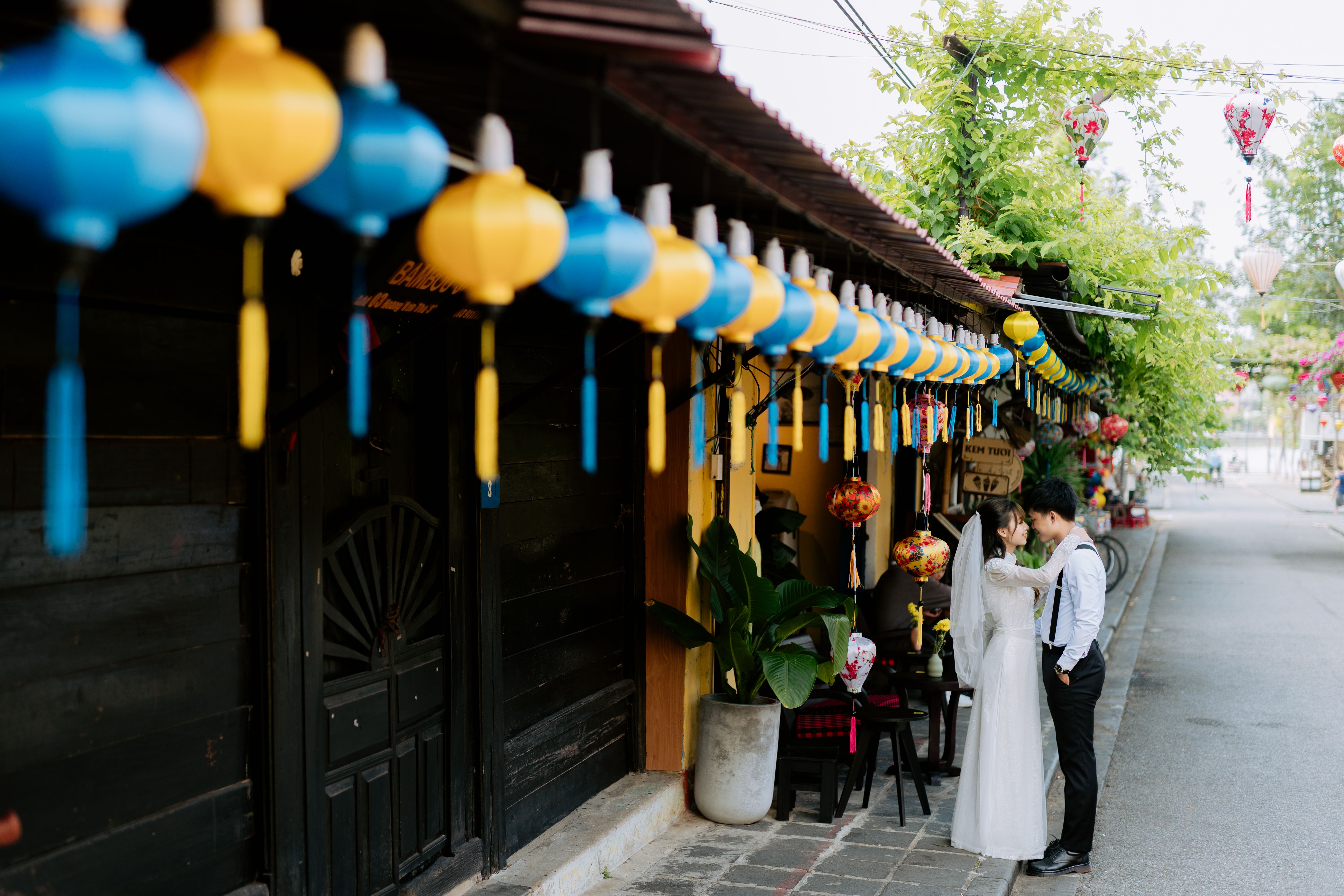 Wedding Couple Standing Together on the Street · Free Stock Photo