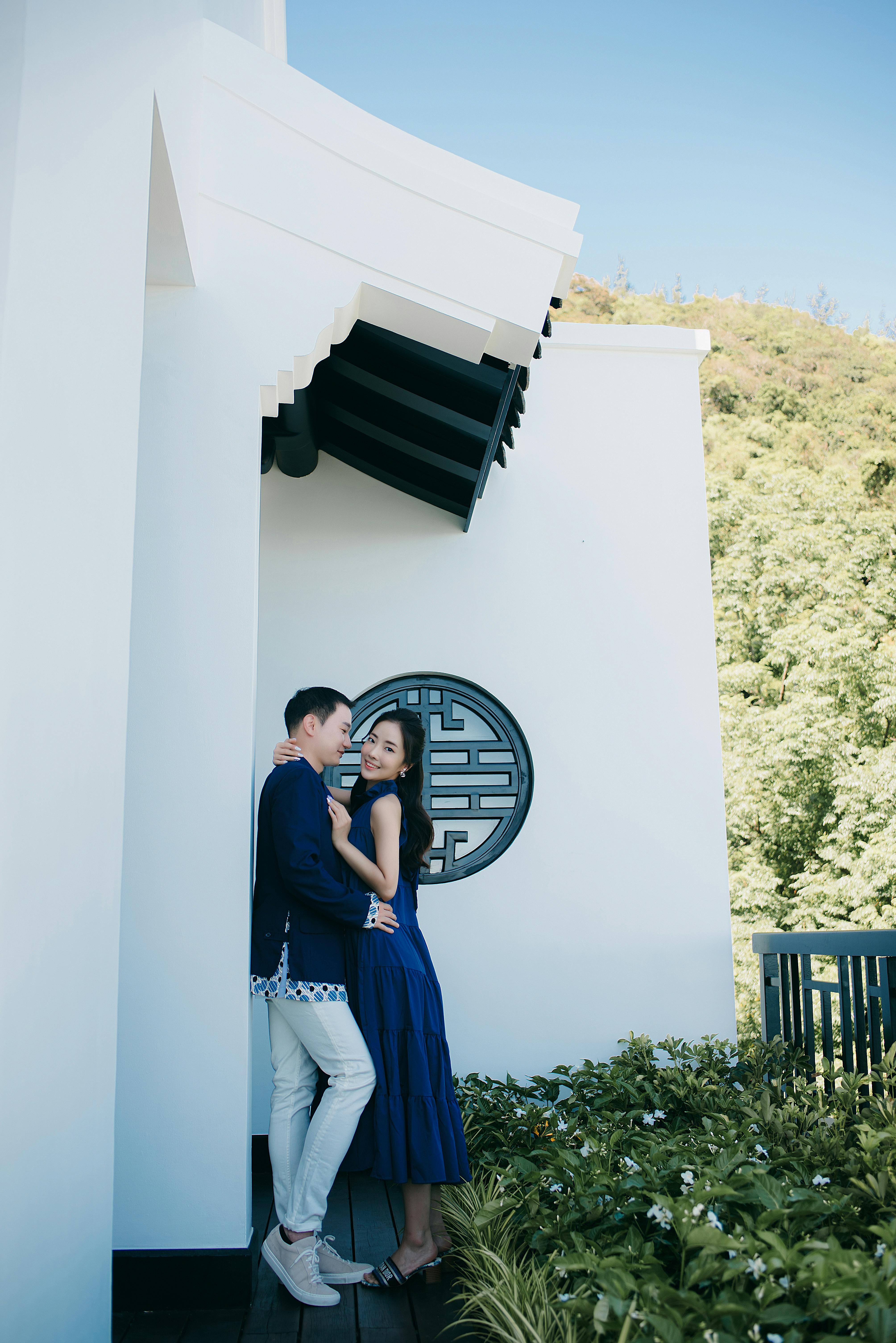 Couple Standing in front of a Building · Free Stock Photo