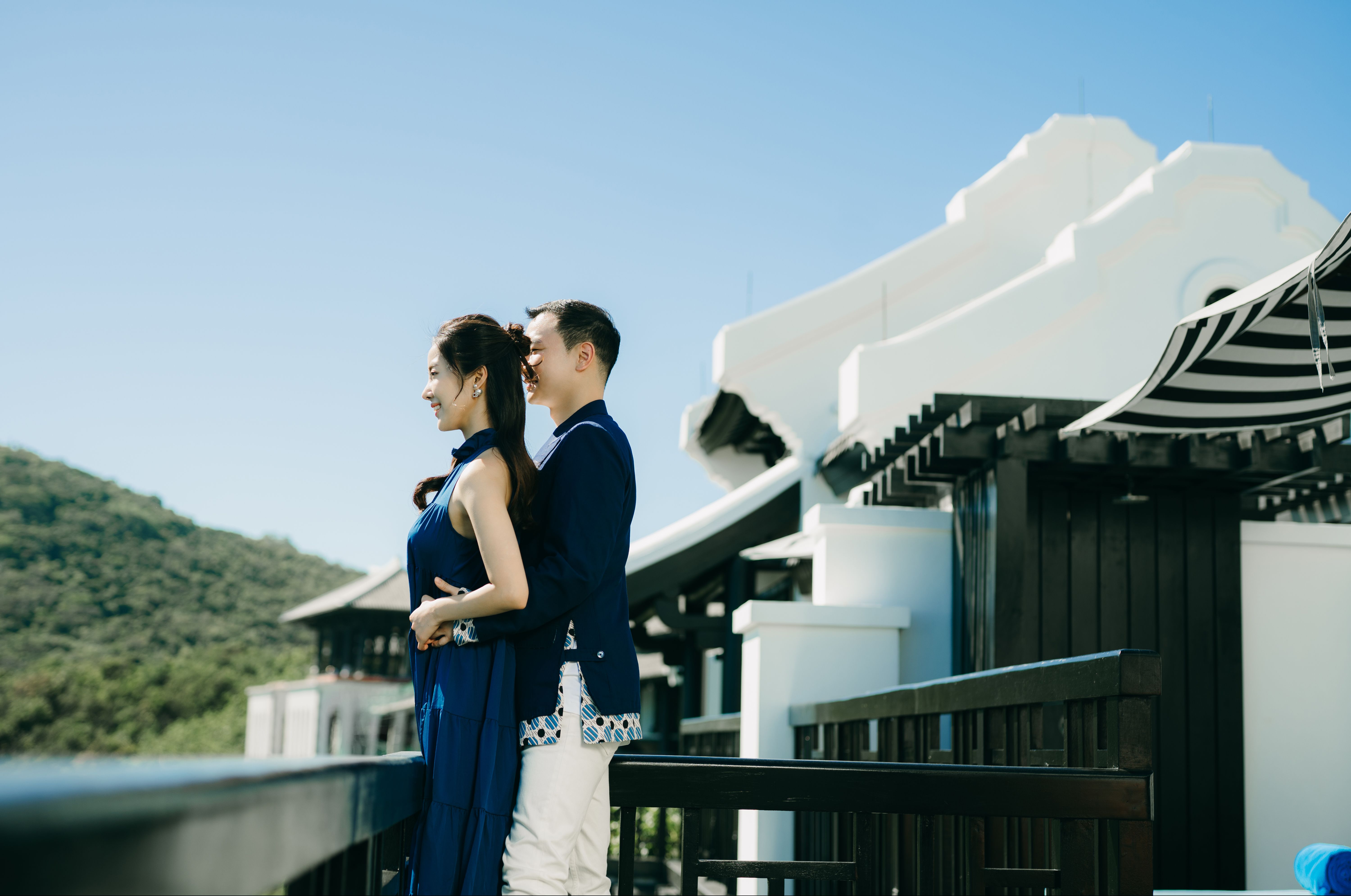 A Side View of a Couple Standing Together · Free Stock Photo