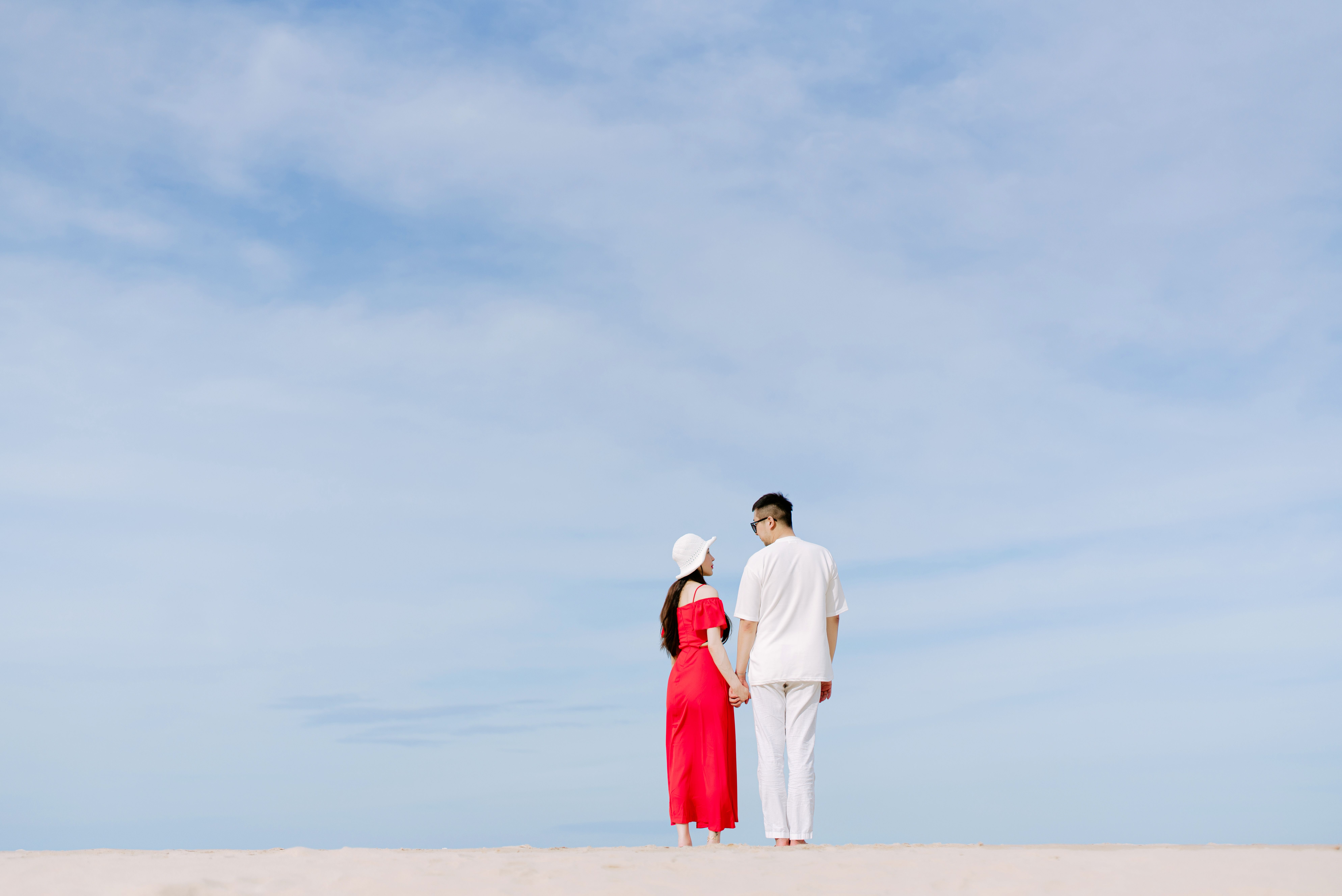 Back View of Couple Doing Holding Hands · Free Stock Photo