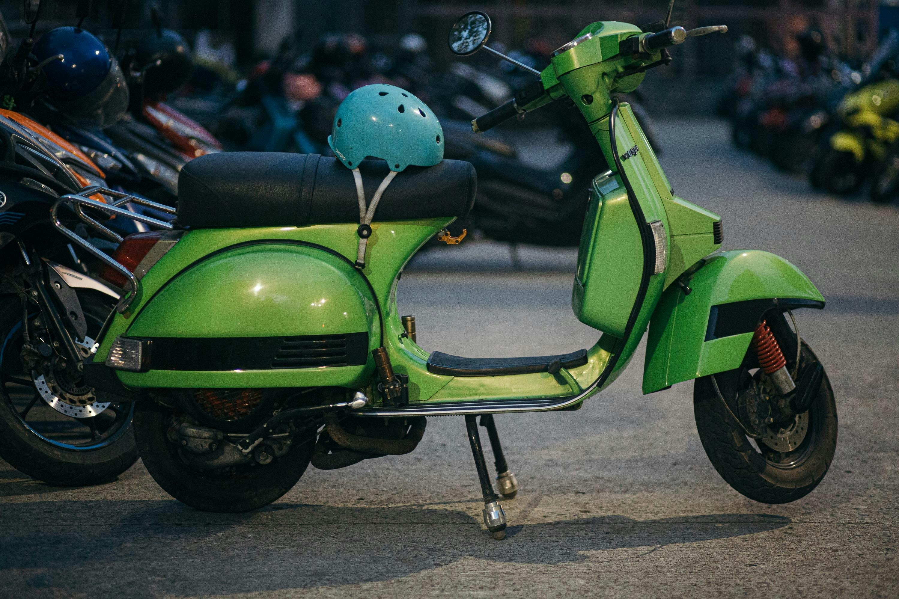 Green and Black Motor Scooter on Road · Free Stock Photo