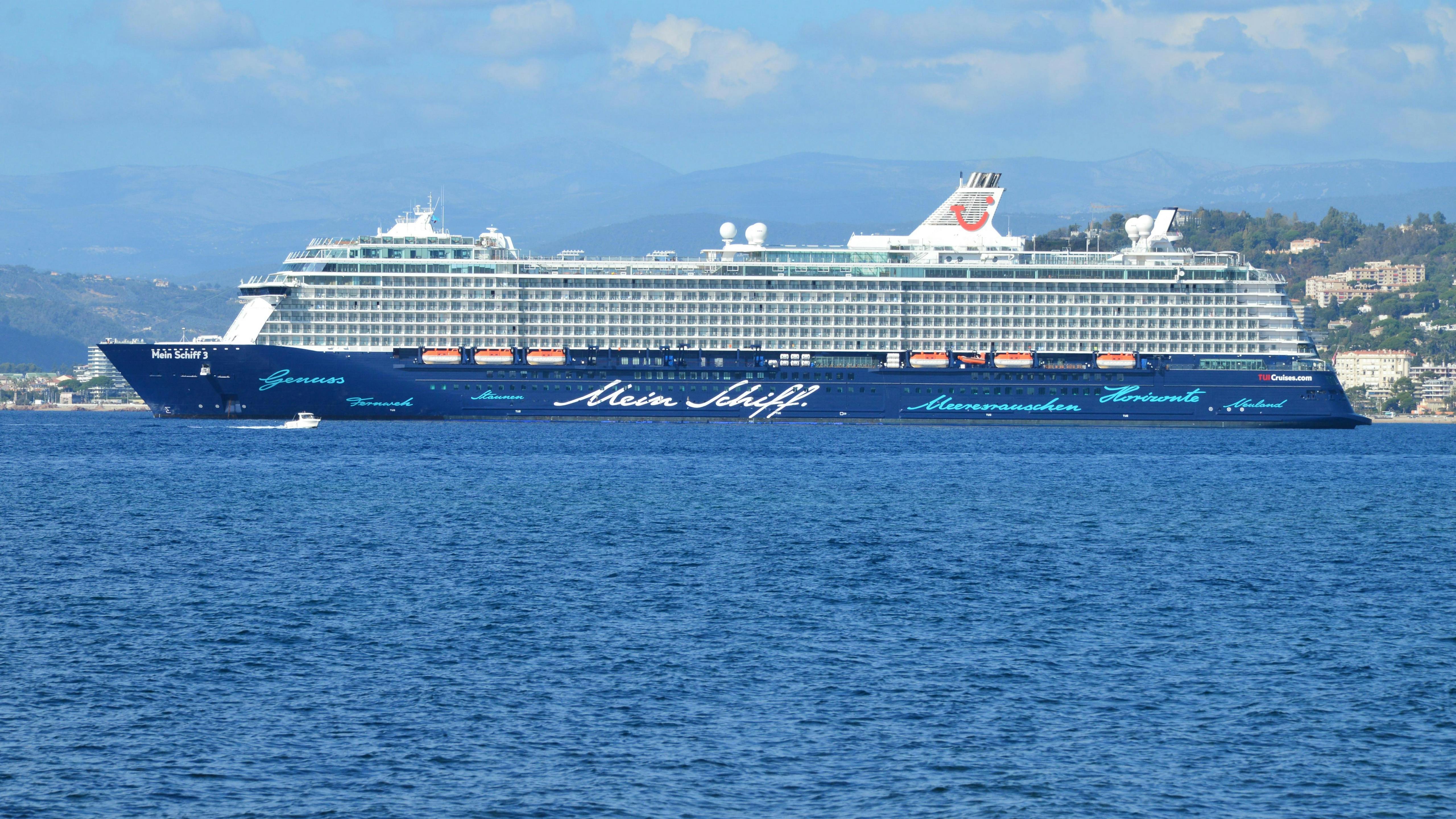 White and Blue Cruise Ship on Sea Under the Blue Sky · Free Stock Photo