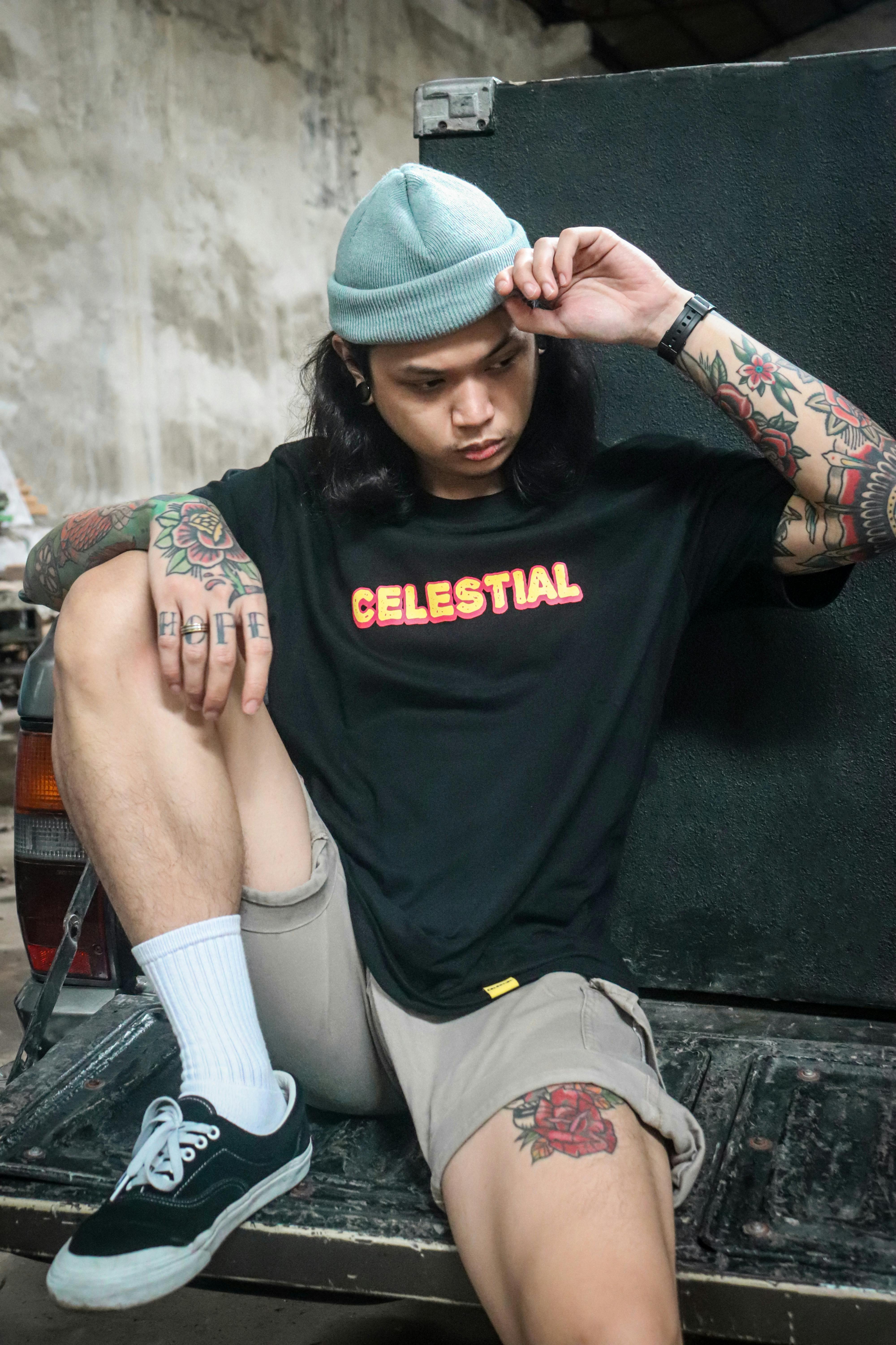 Photo of a Man Touching His Gray Beanie · Free Stock Photo