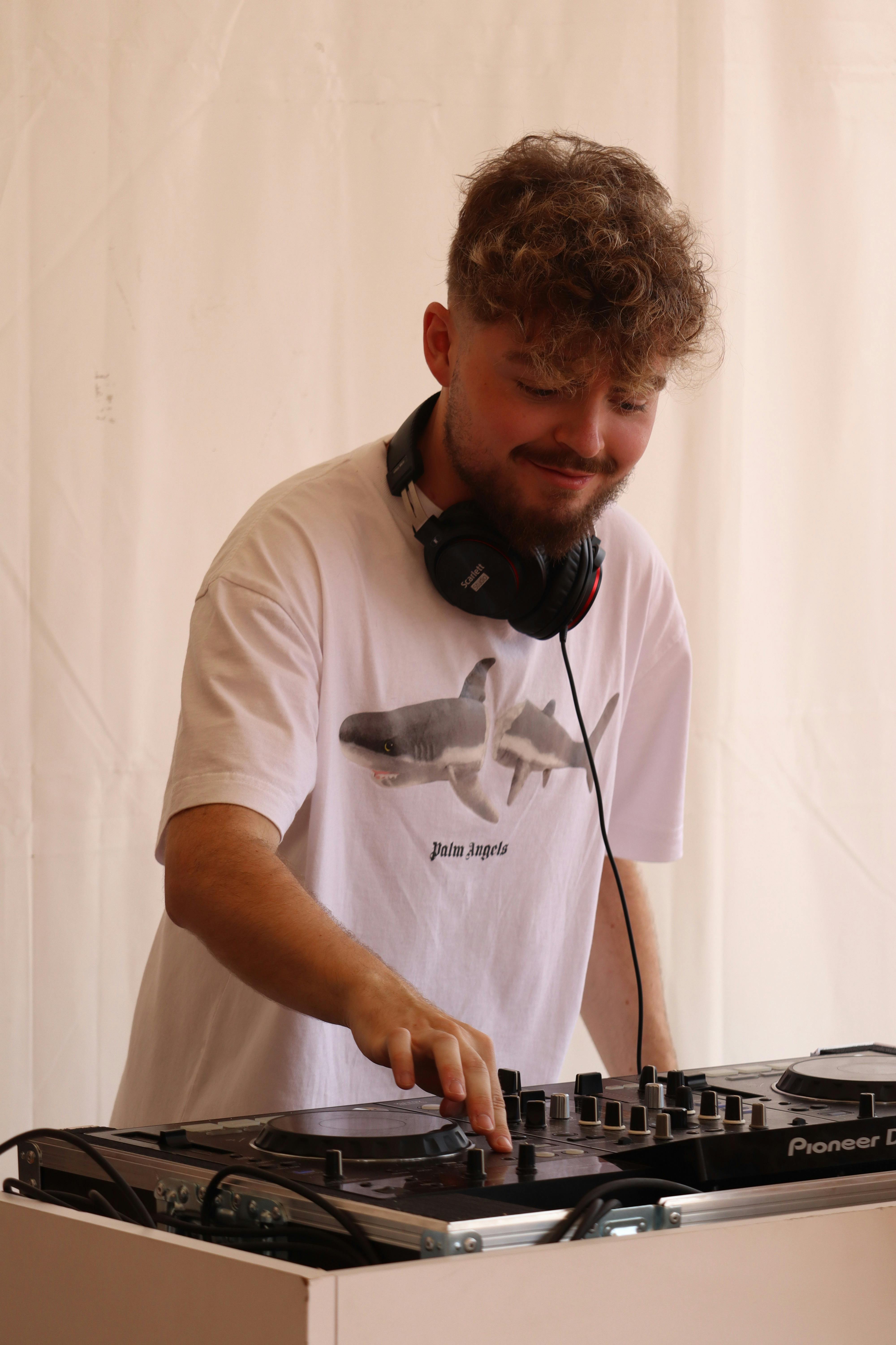 A Disc Jockey Performing on a Nightclub while Wearing Shades · Free ...