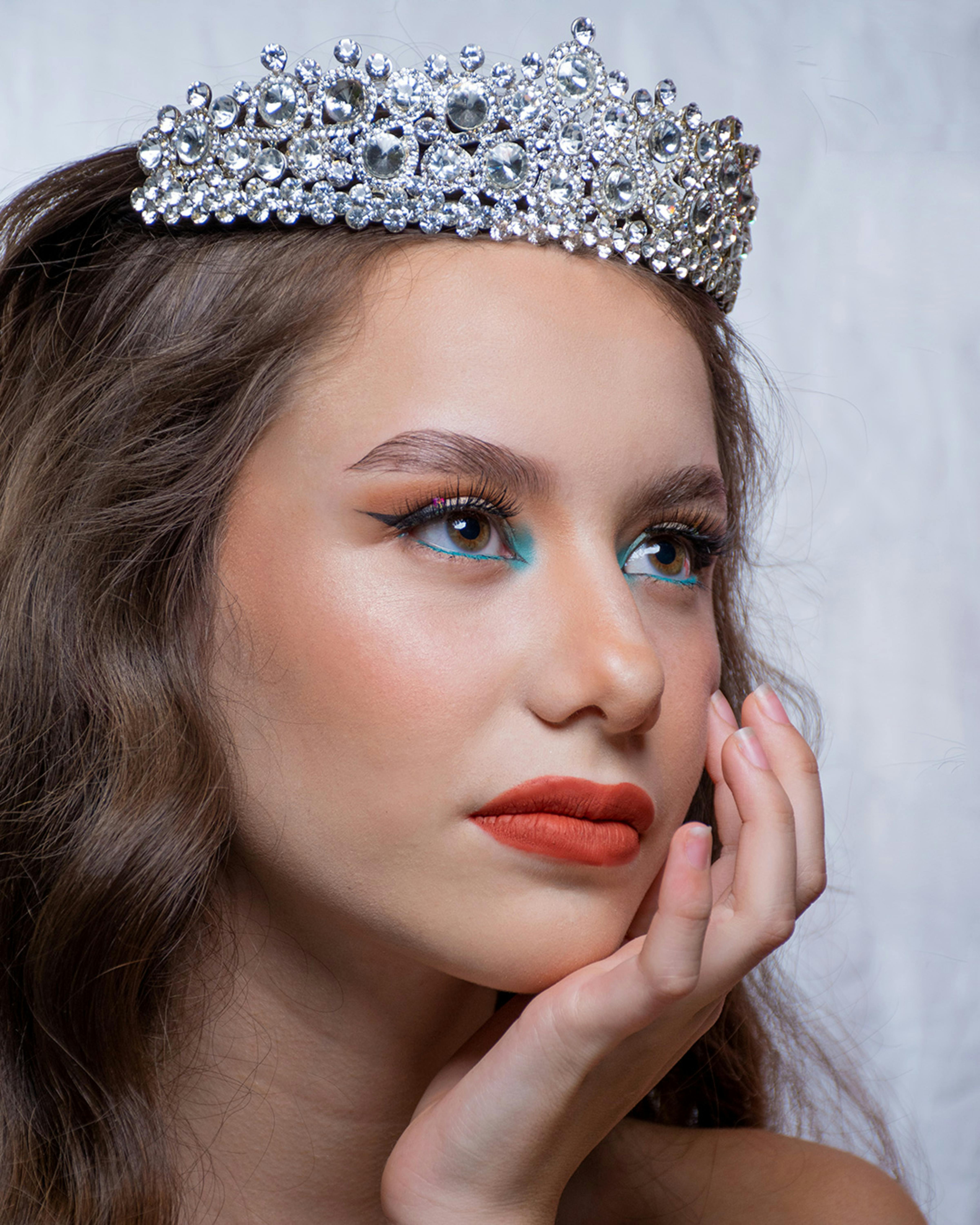 A Princess Posing with Her Hand on Her Chin · Free Stock Photo