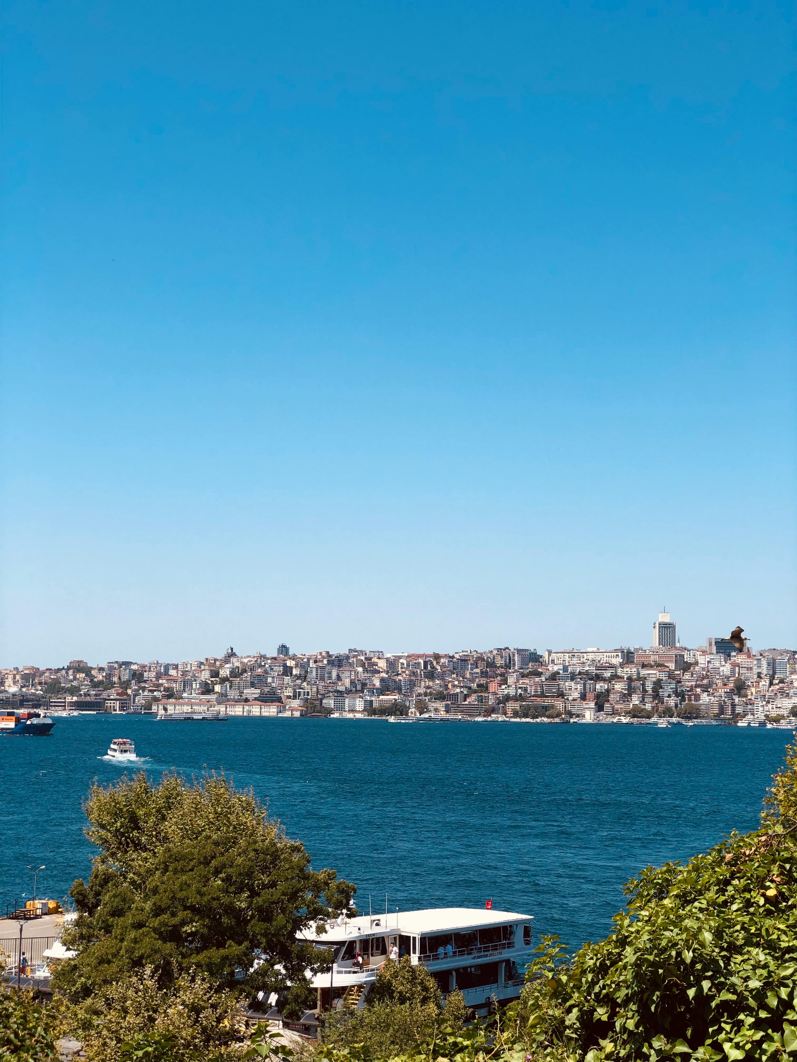 Photo of a Restaurant Table on a Harbor Promenade · Free Stock Photo