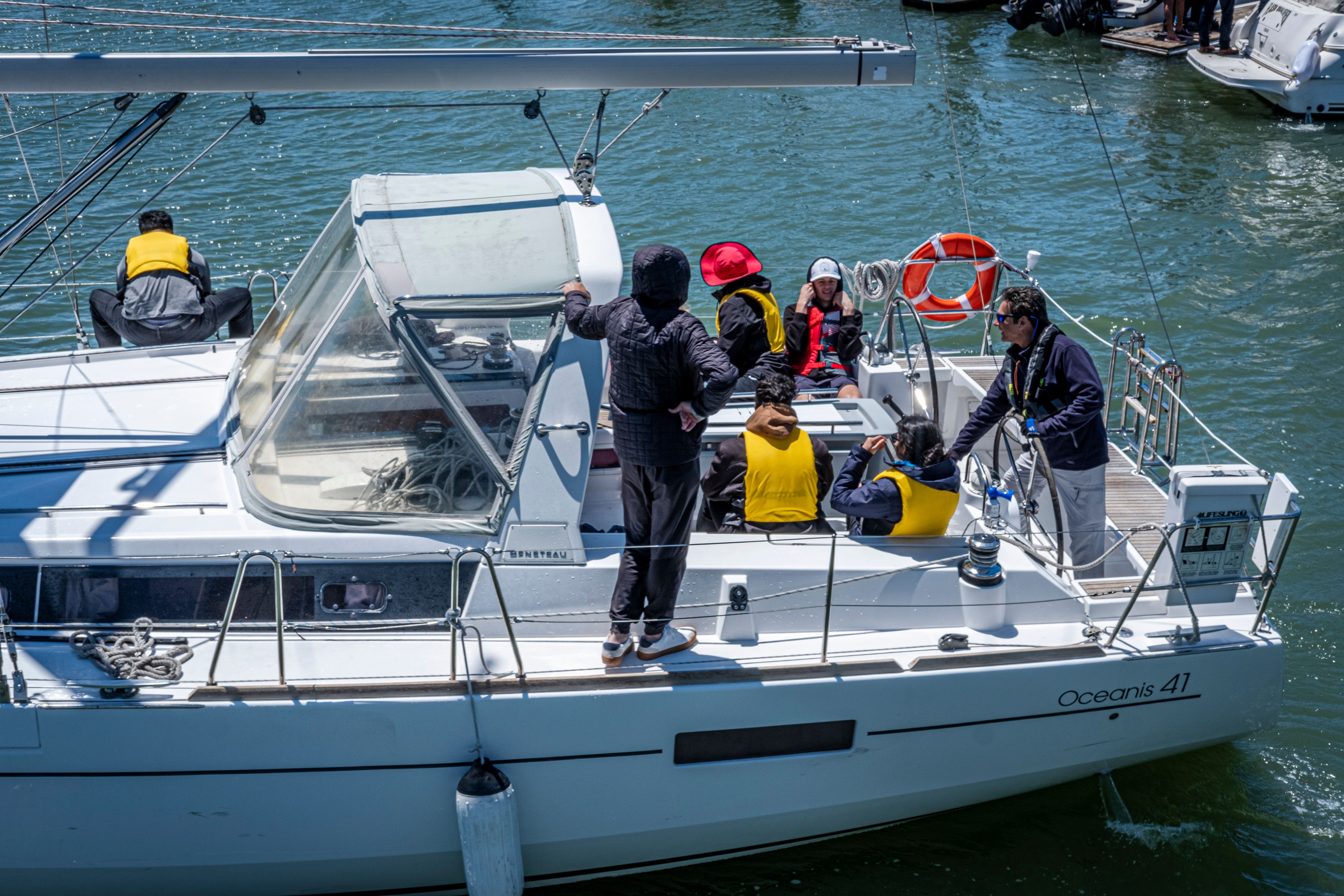 Group of Men Riding on White Boat · Free Stock Photo