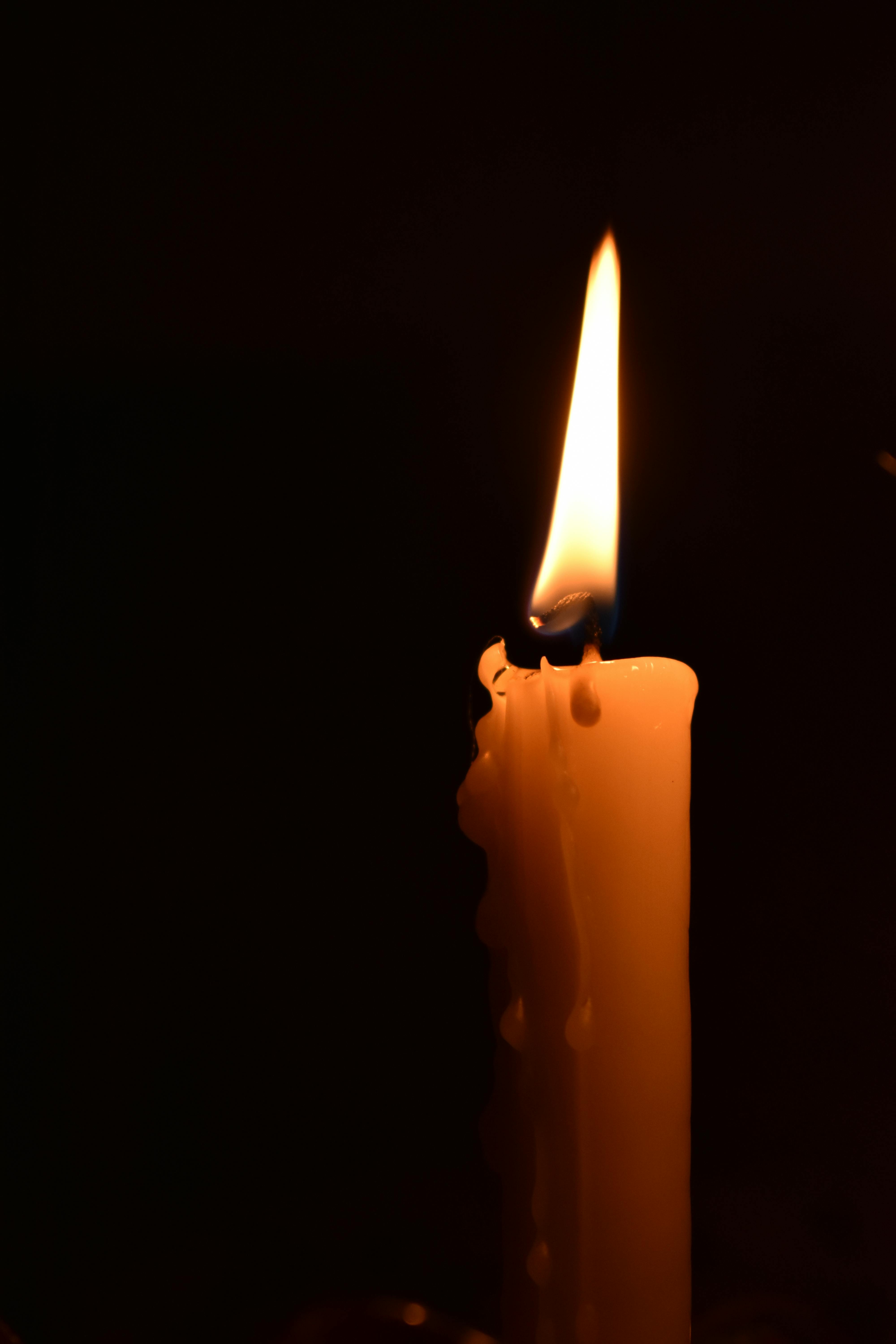 Close-Up Shot of a Lighted Candle · Free Stock Photo