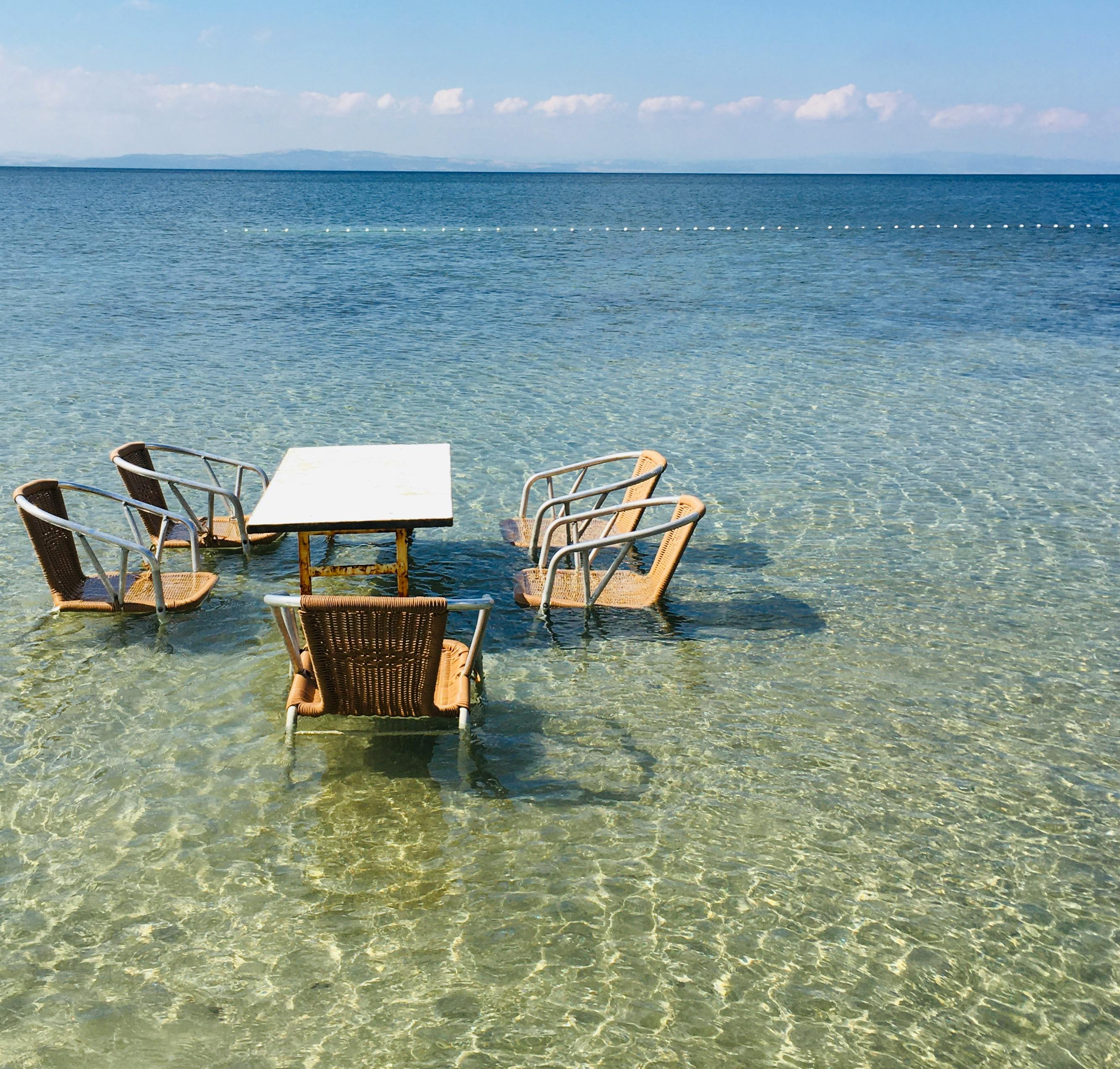 White Table with Chairs on the Beach · Free Stock Photo