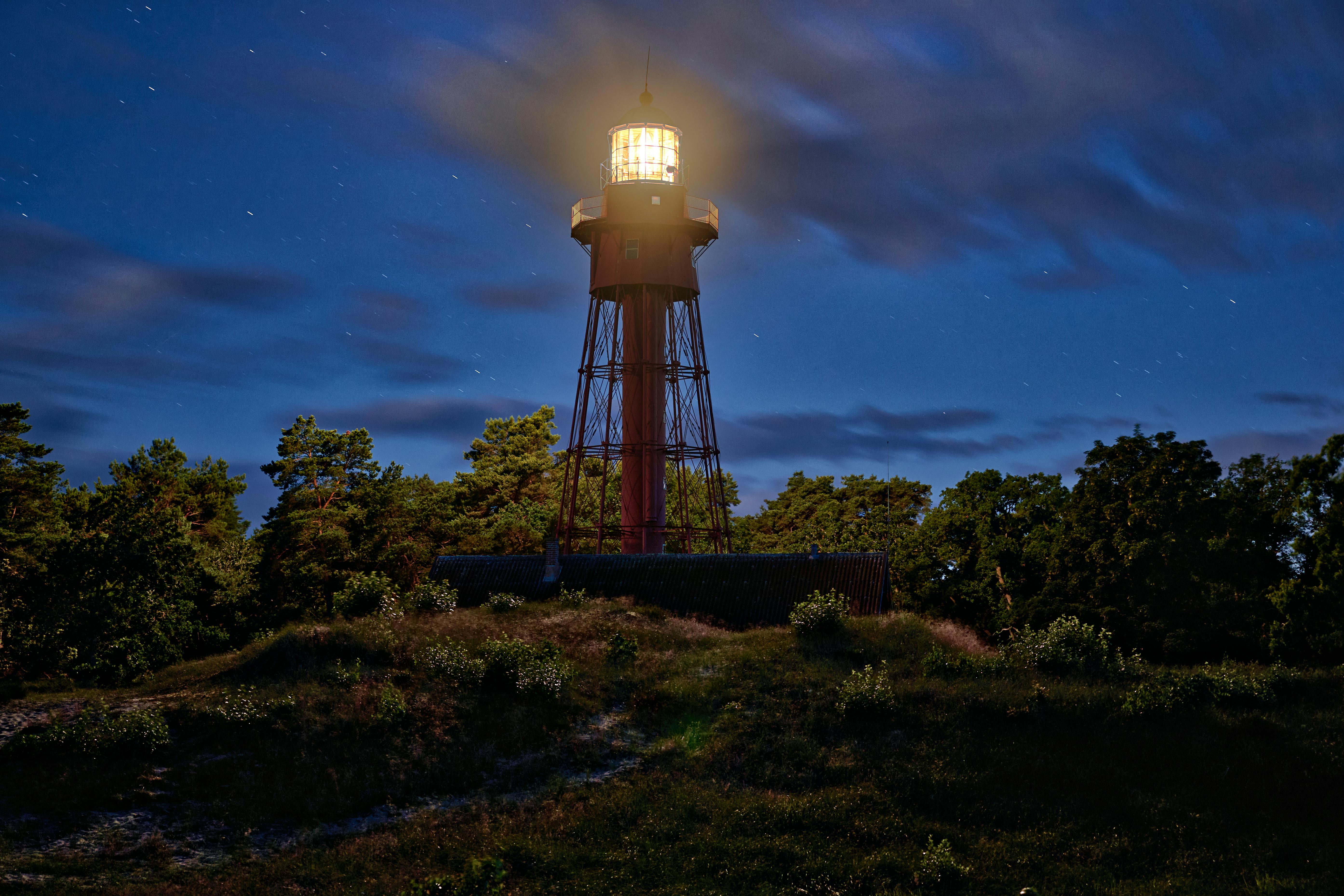 Illuminated Lighthouse During Night Time · Free Stock Photo