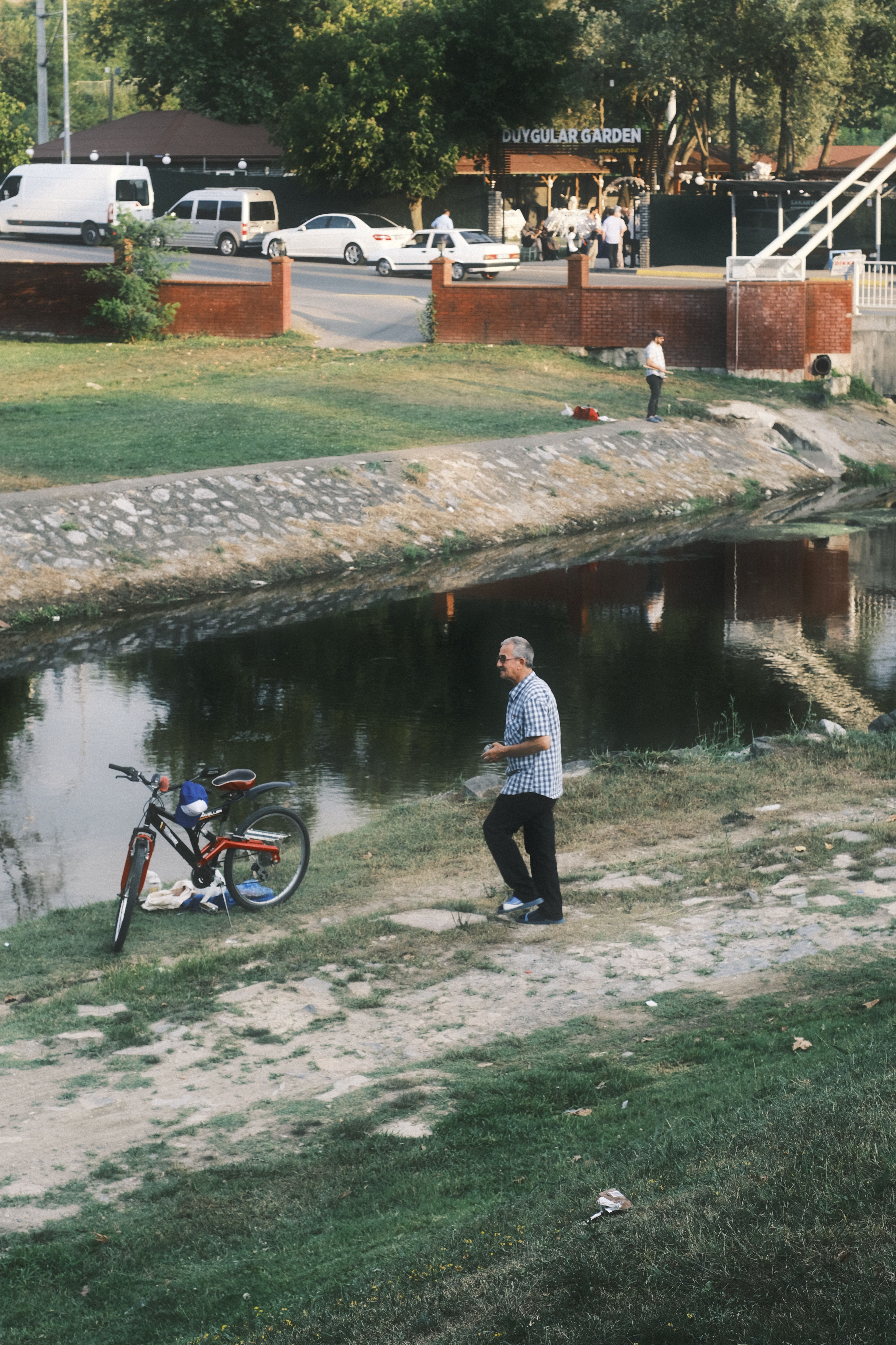 A Man Walking Near the River · Free Stock Photo
