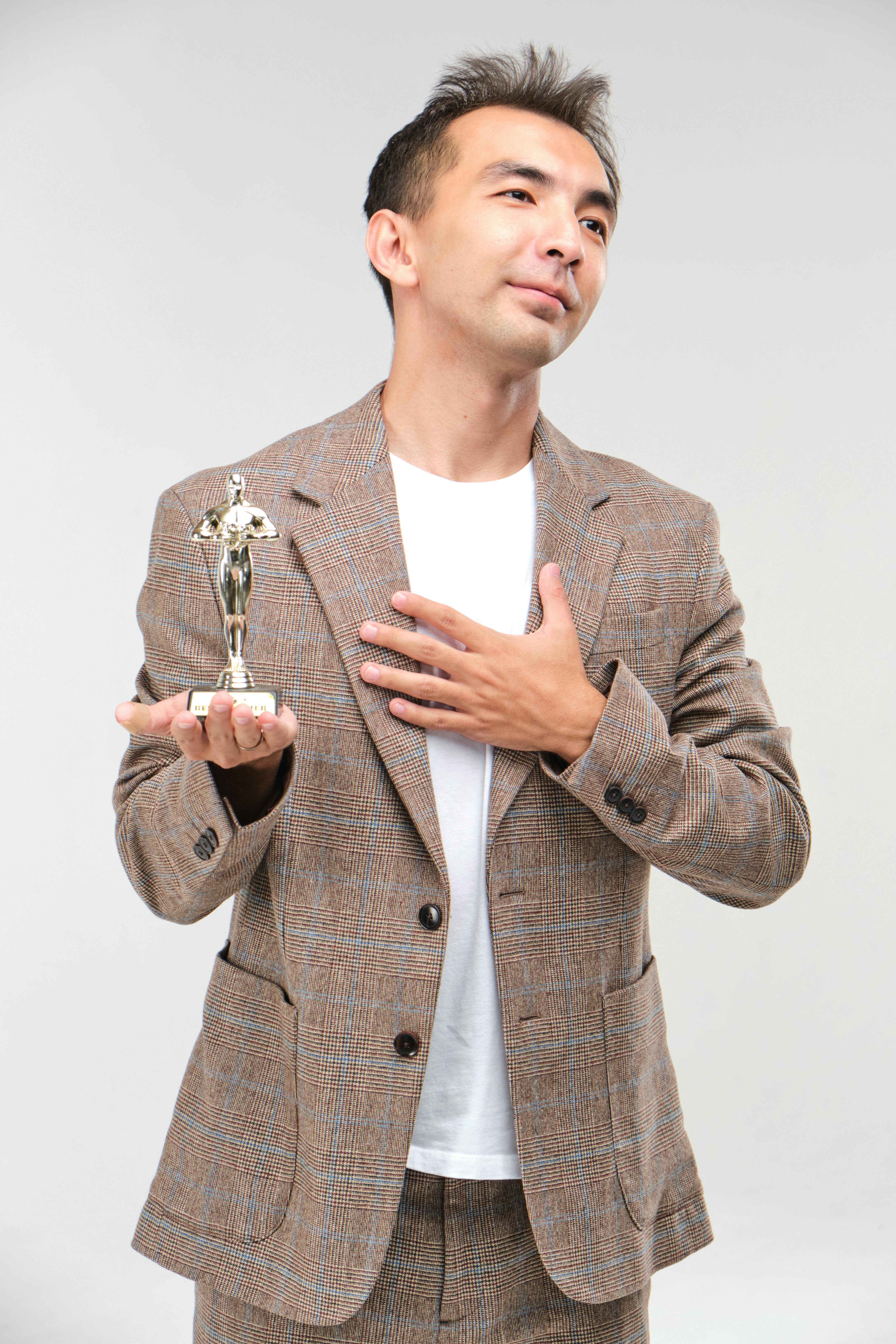 A Man With a Trophy · Free Stock Photo