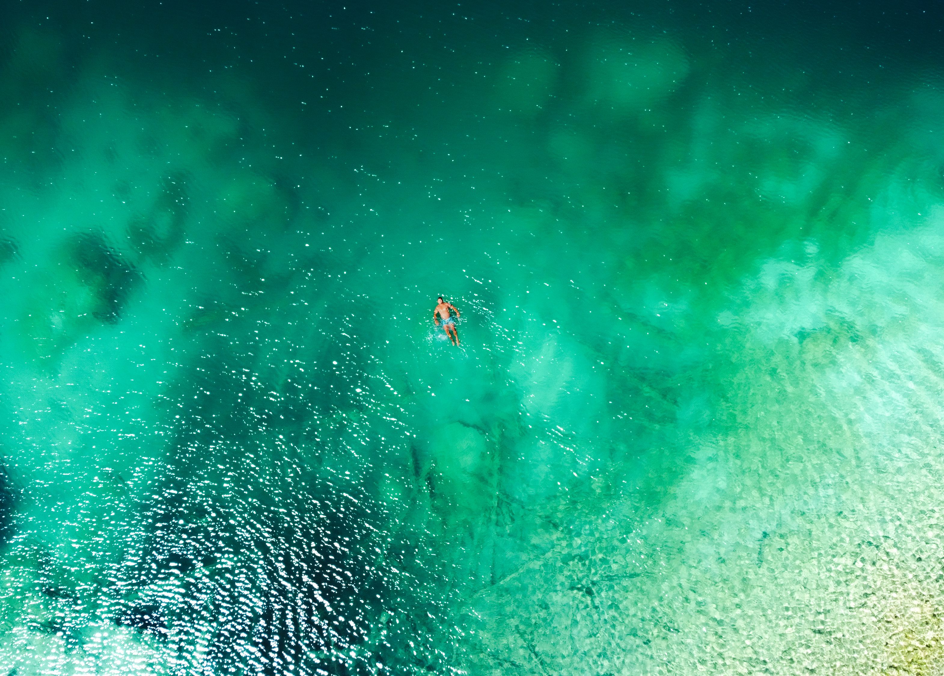 Aerial Photography of a Man on the Sea · Free Stock Photo