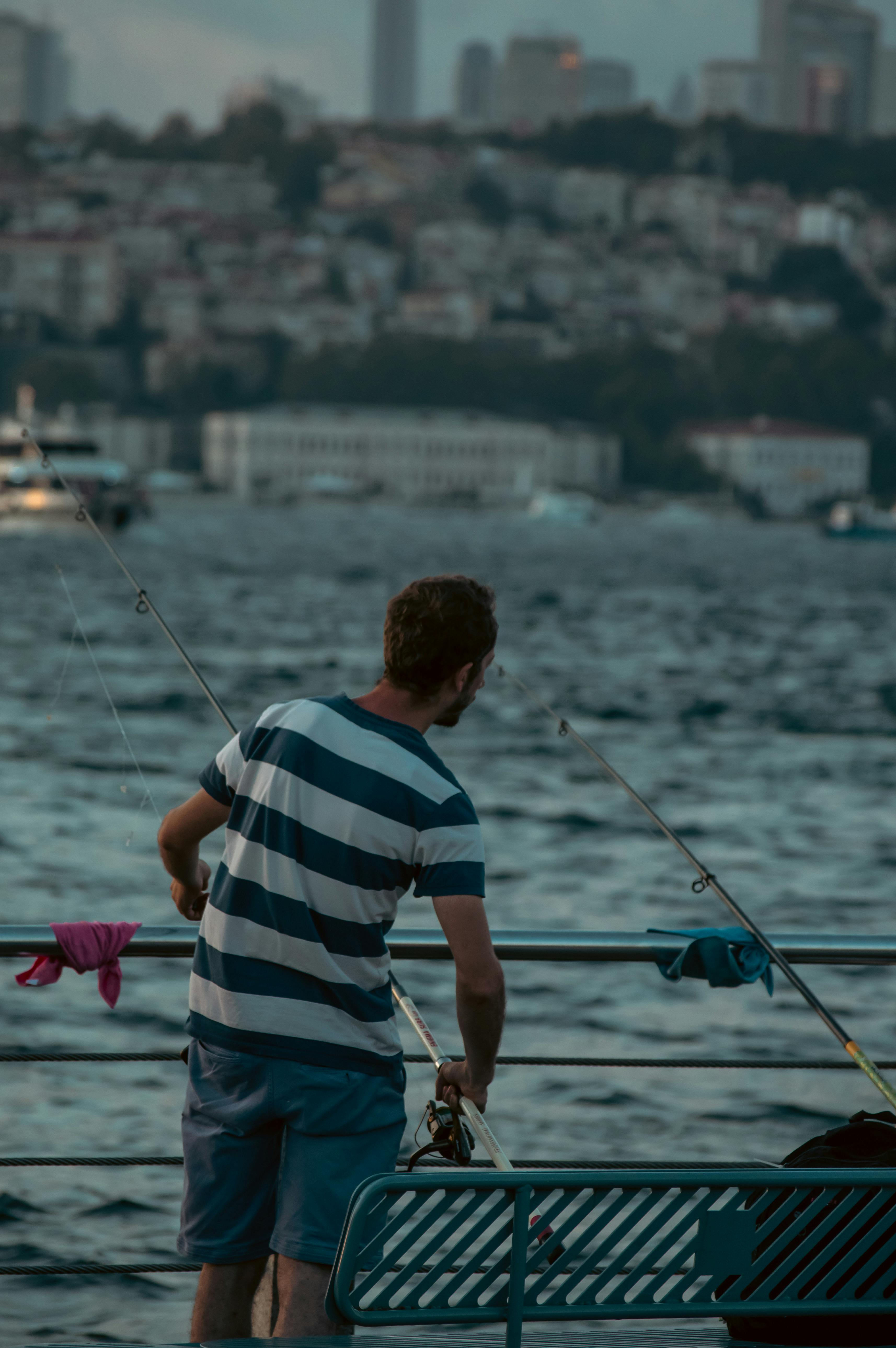 A Man Using Fishing Rod · Free Stock Photo