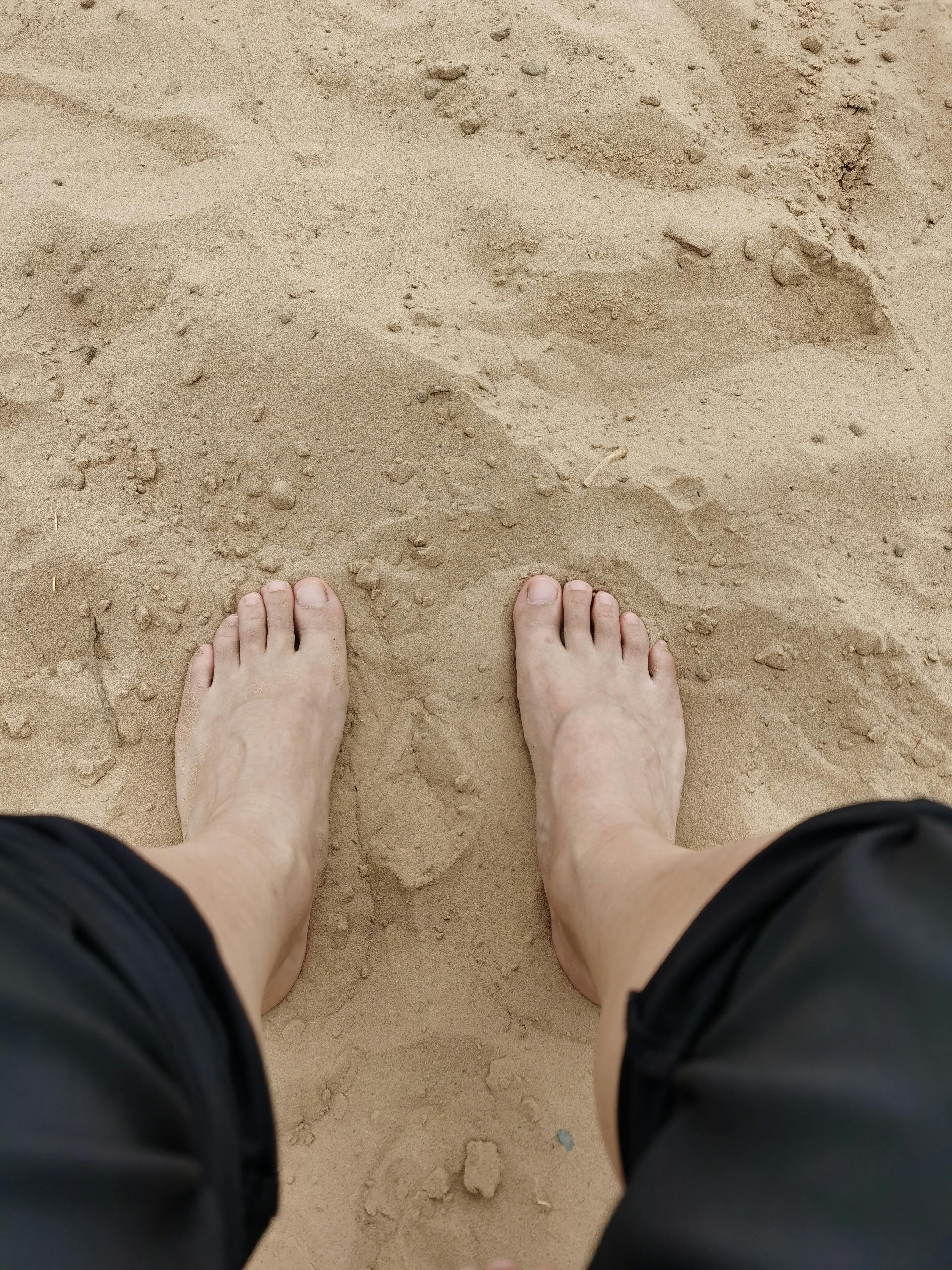 Top View of a Barefoot on the Sand · Free Stock Photo