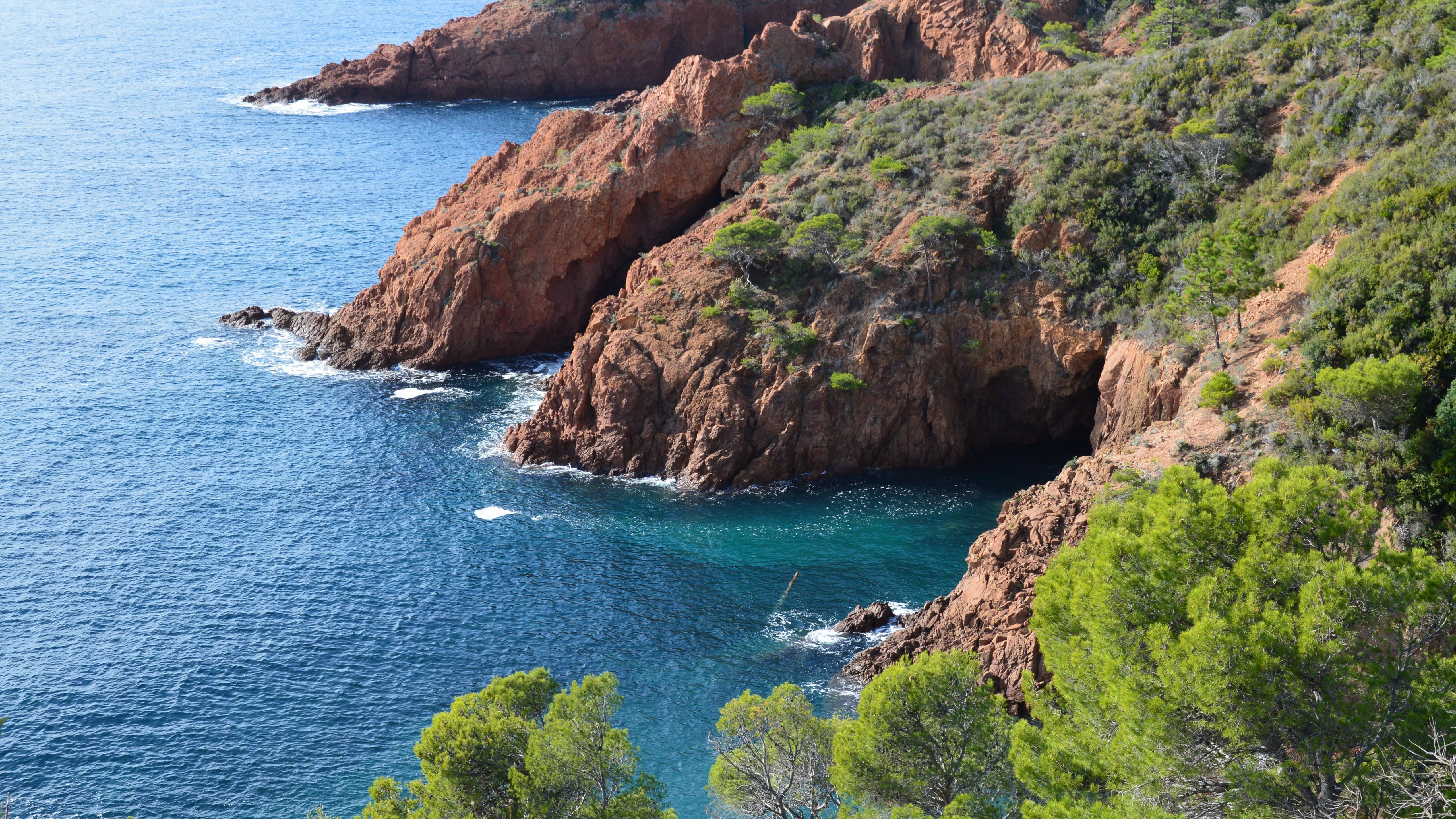 Aerial View of a Rocky Coastal Cliff · Free Stock Photo