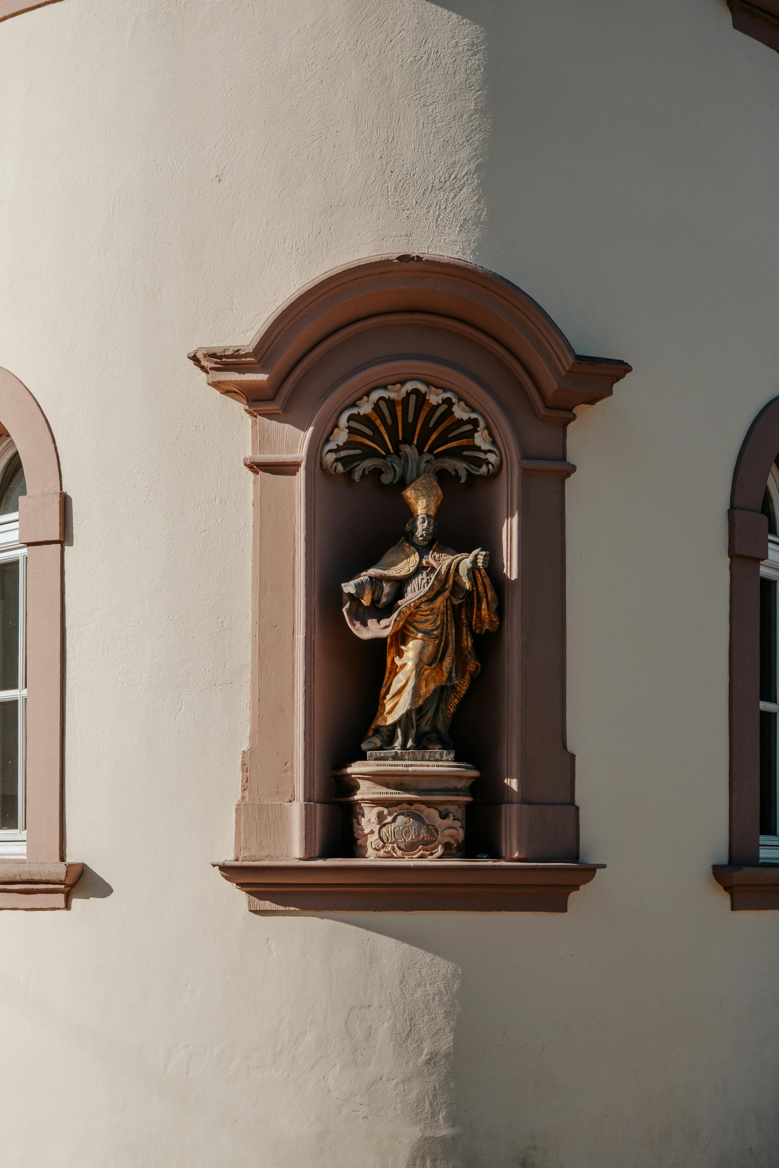 Statue of a Religious Saint on a Church Facade · Free Stock Photo
