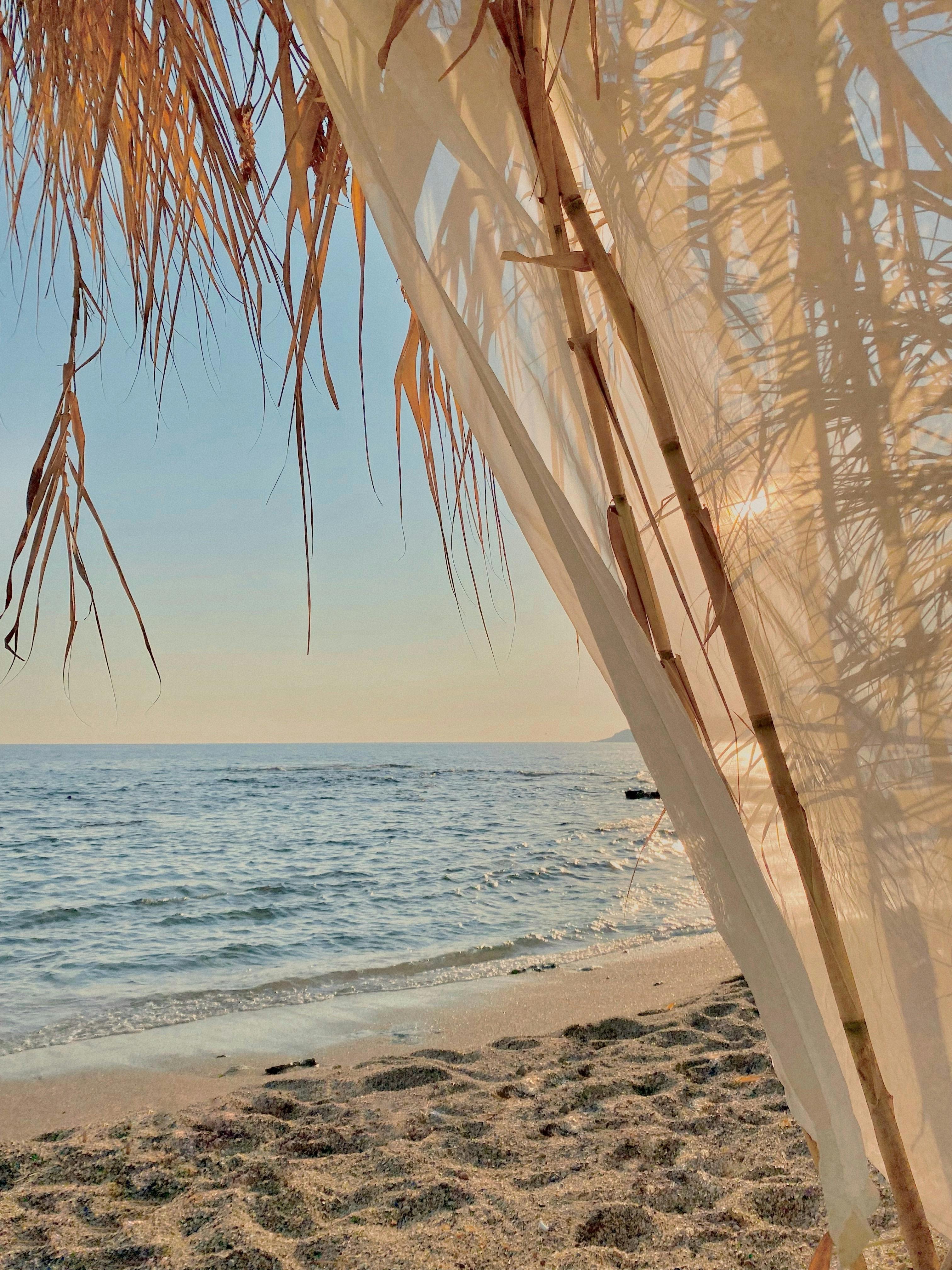 A White Parasol on the Beach · Free Stock Photo