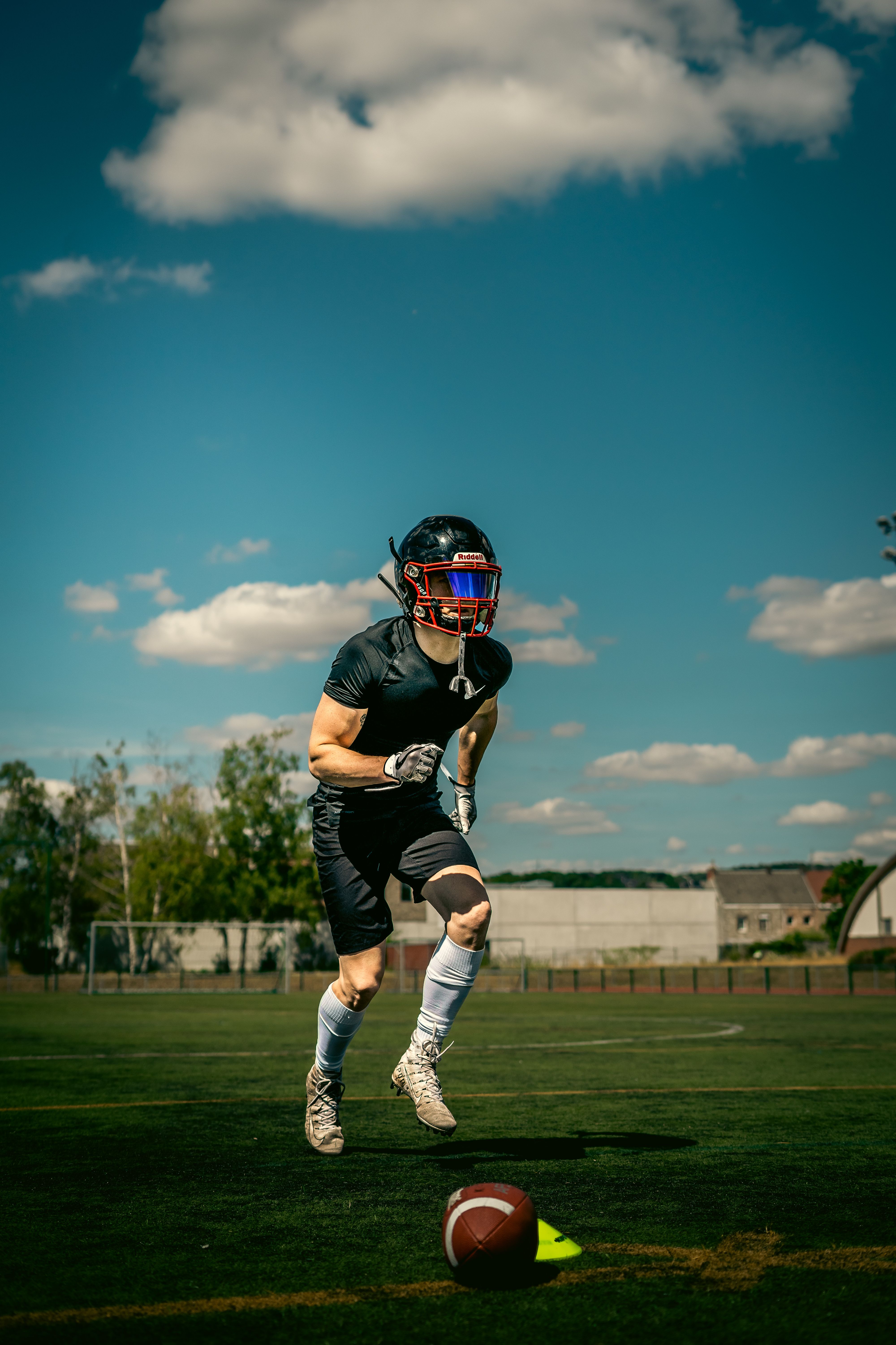 A Football Player Wearing a Helmet · Free Stock Photo
